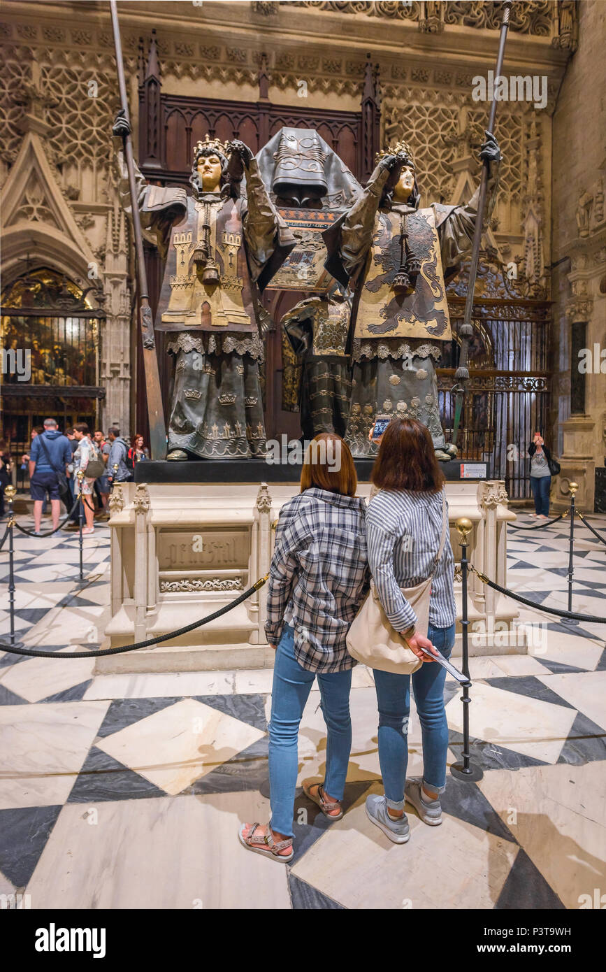 Christopher Columbus Seville, two young women tourists view the tomb of ...