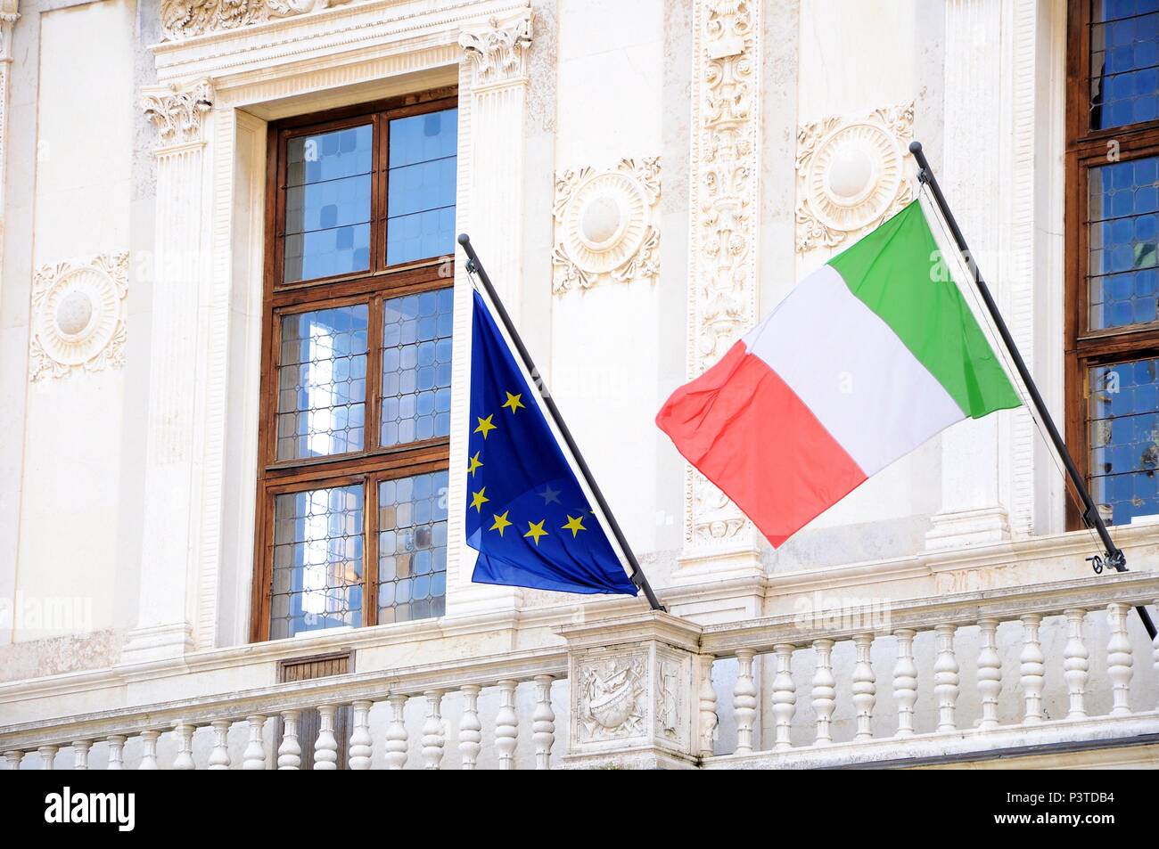 Italian and European flags on municipal building facade Stock Photo - Alamy