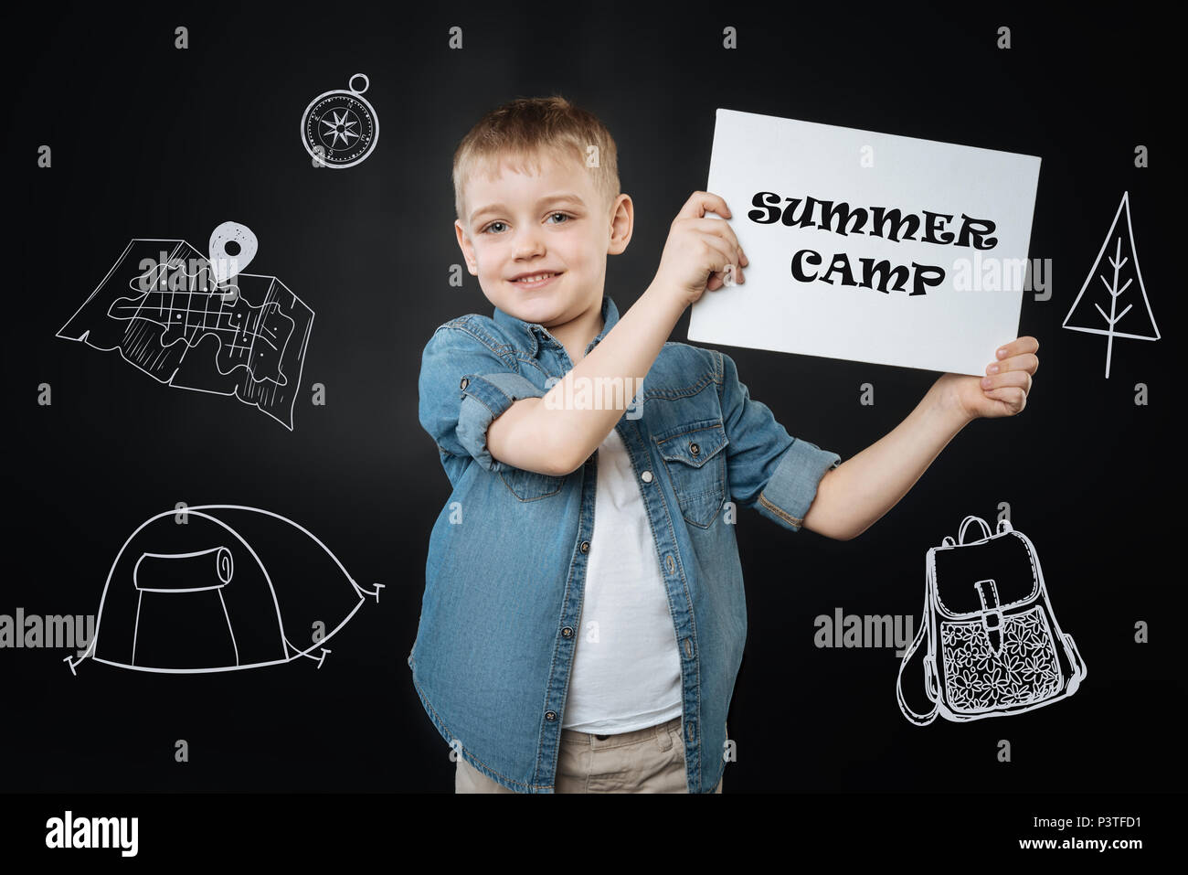 Active boy smiling and relaxing in a summer camp Stock Photo - Alamy