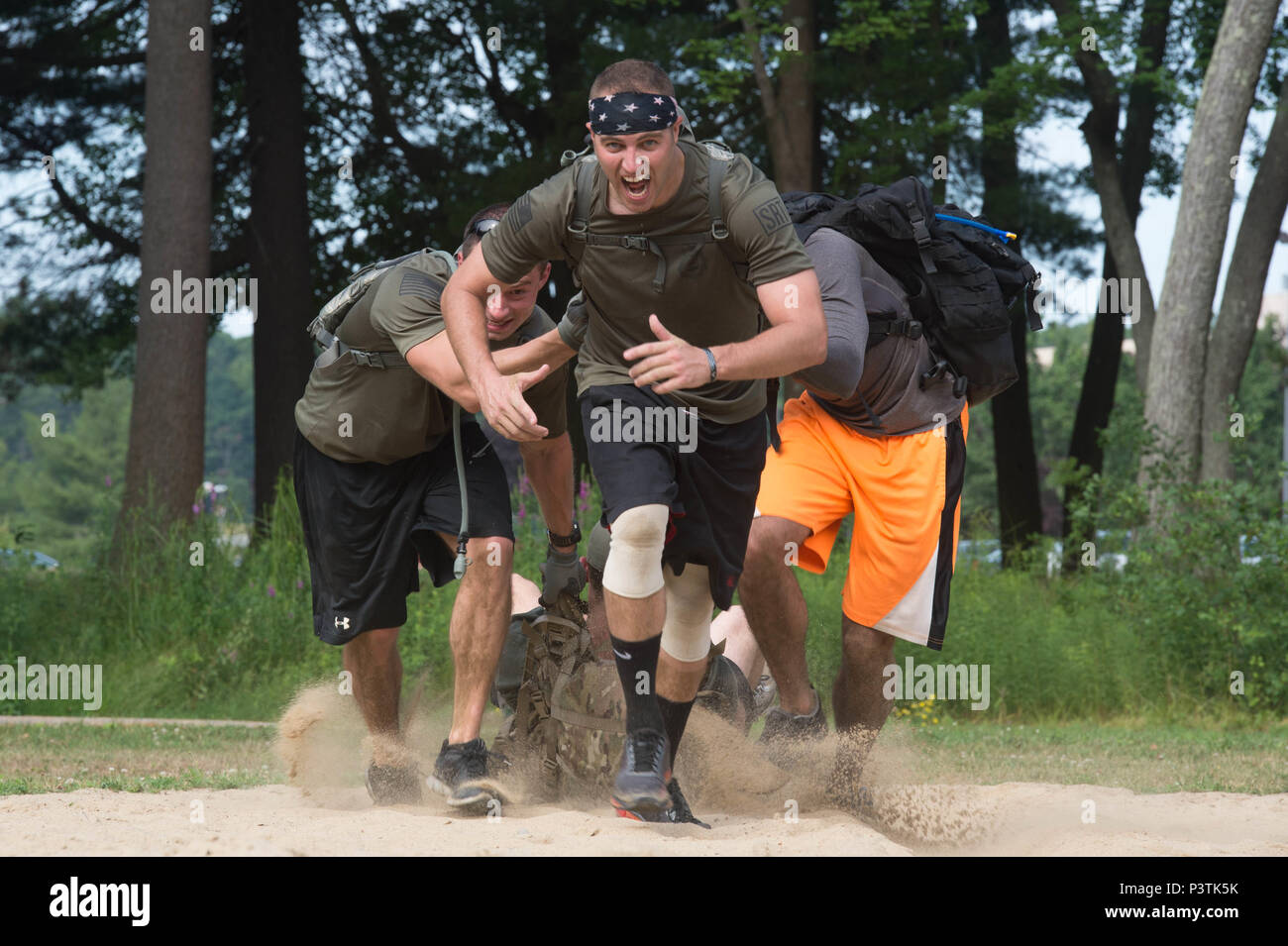 Tech. Sgt. Matthew Marquart, center, 66th Security Forces Squadron ...