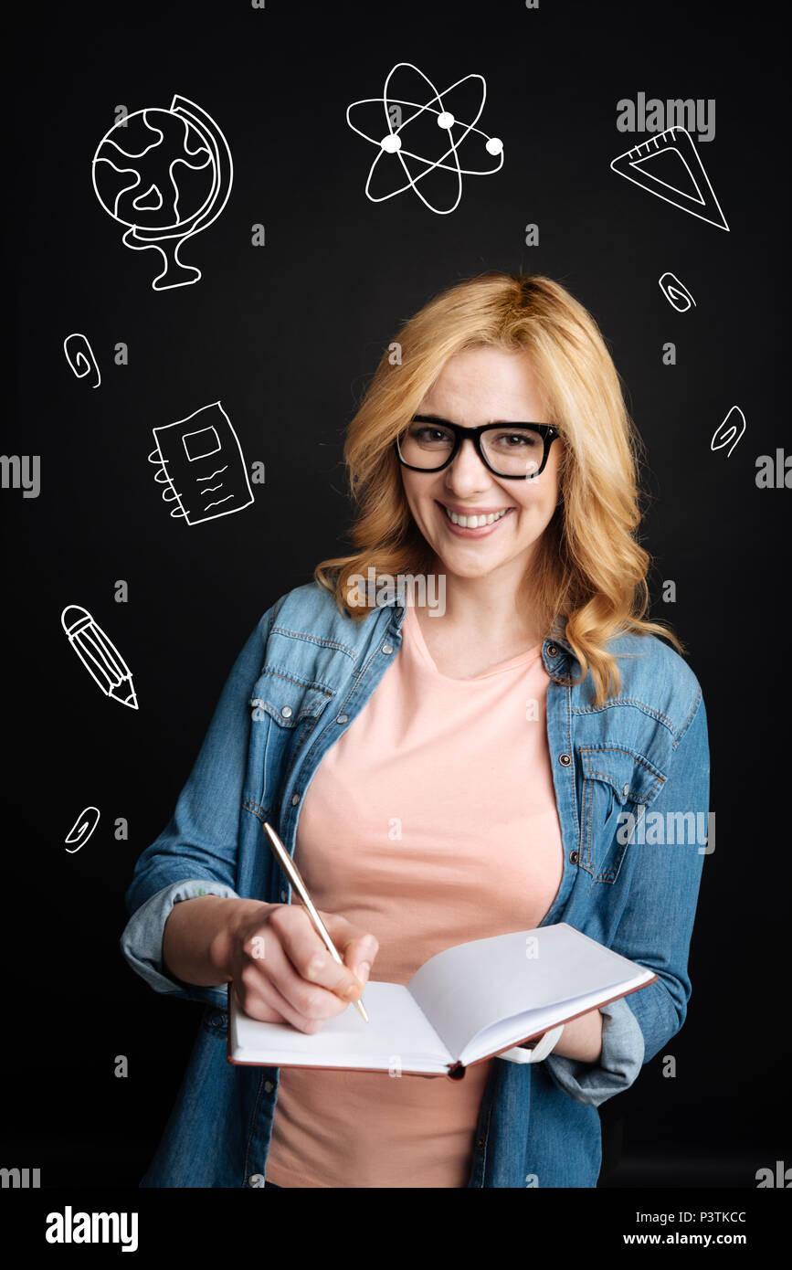 Happy teacher making notes and enjoying summer holidays Stock Photo - Alamy