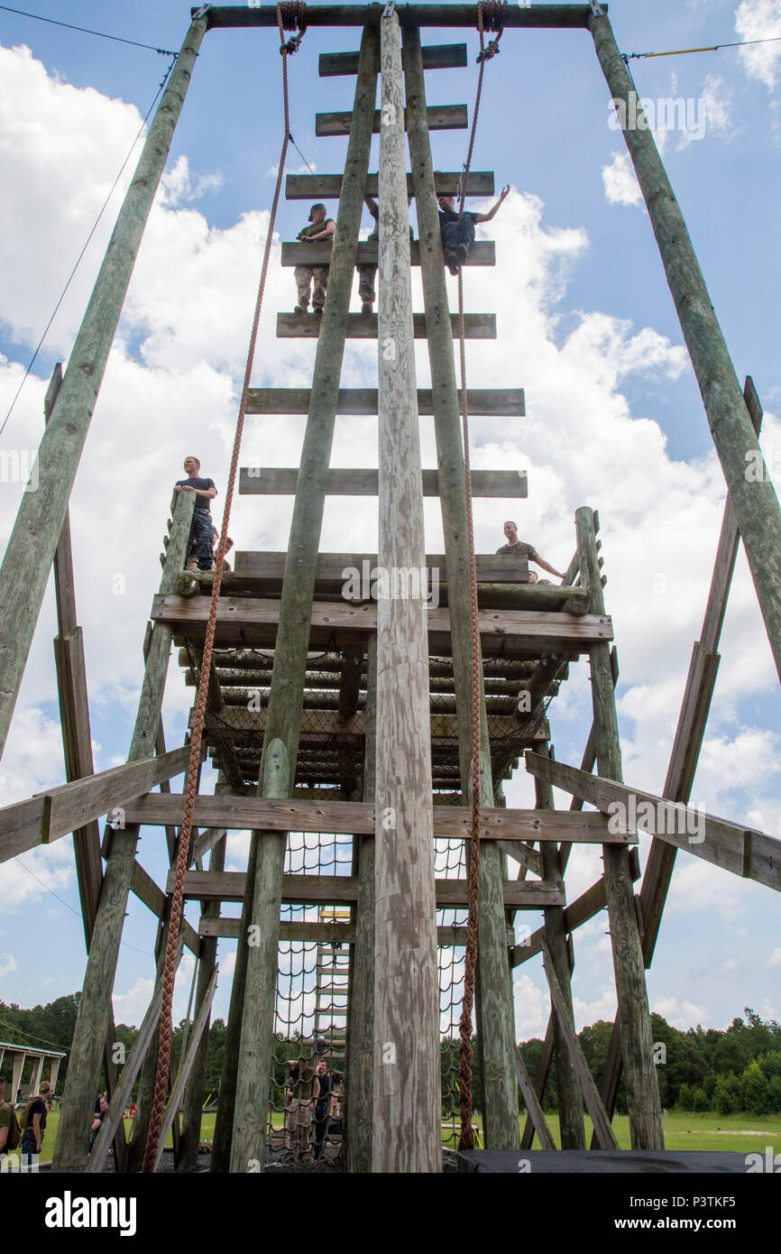 U.S. Naval ROTC Midshipmen prepare to repel from an A frame during a ...