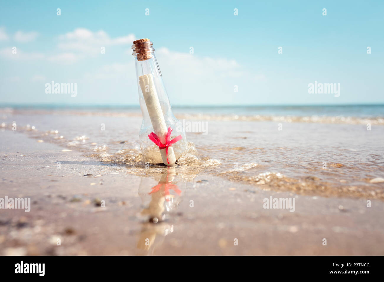 Message in a bottle washed up on a beach concept for help, sos ...
