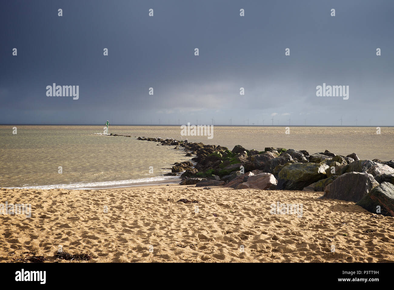 Wind turbines at Gunfleet Sands just off shore of Clacton on Sea Essex ...