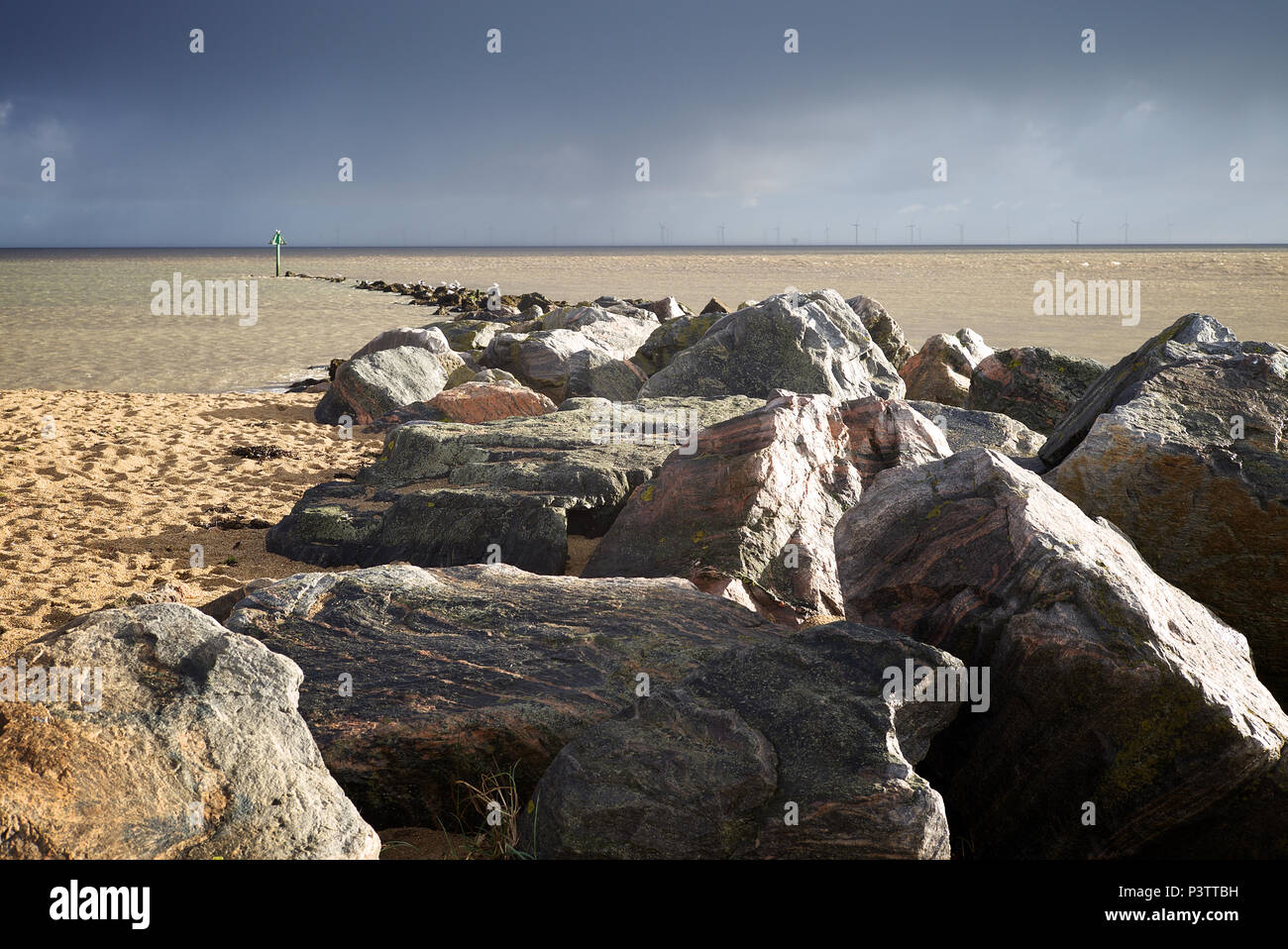 Wind turbines at Gunfleet Sands just off shore of Clacton on Sea Essex ...