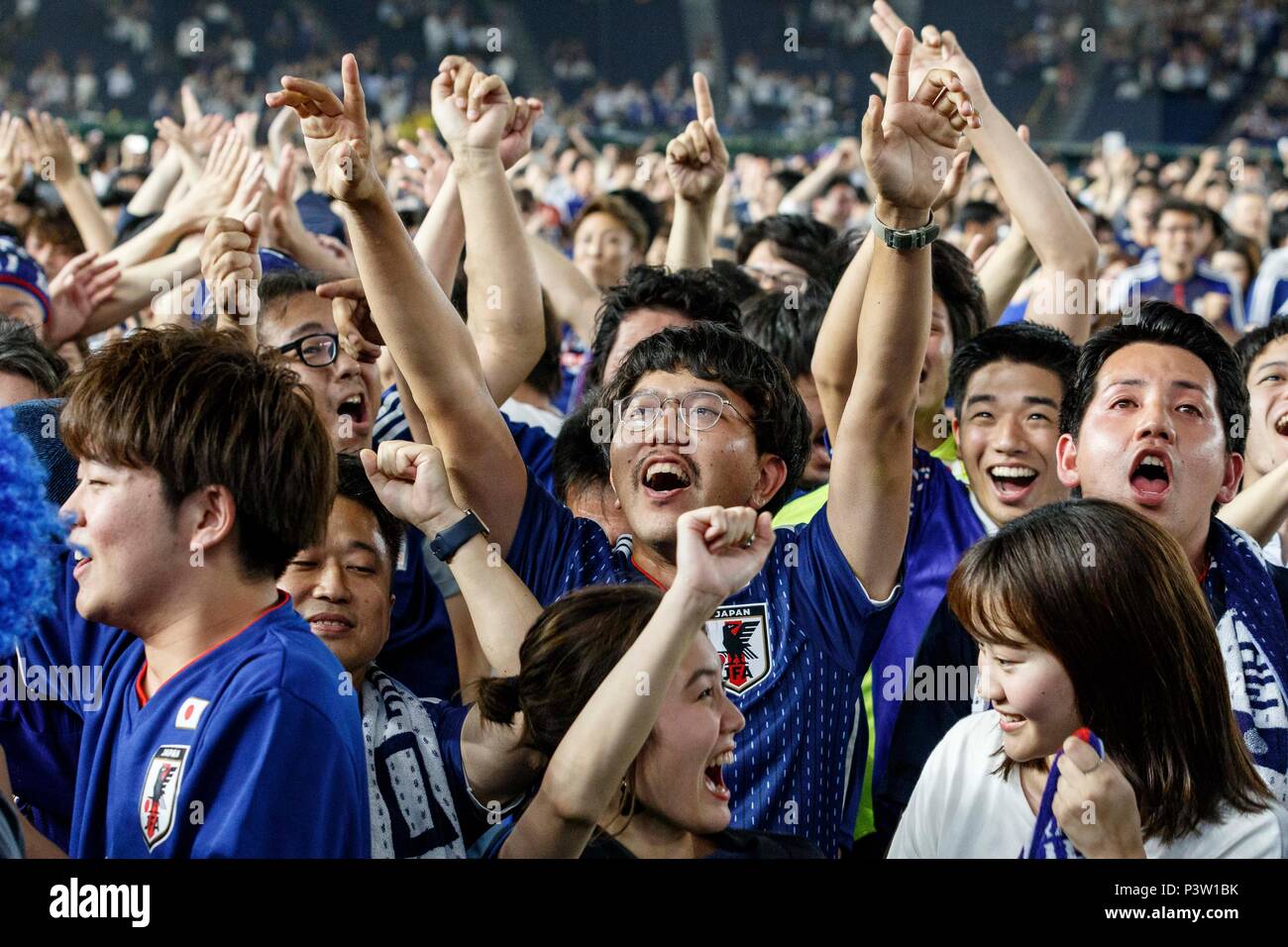 Japanese soccer fans cheer on in excitement as they watch the FIFA ...