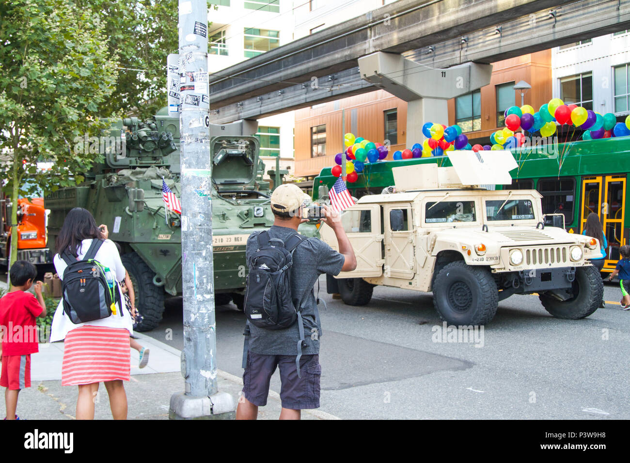 Seattle pedestrians check out some of the U.S. Army vehicles provided ...