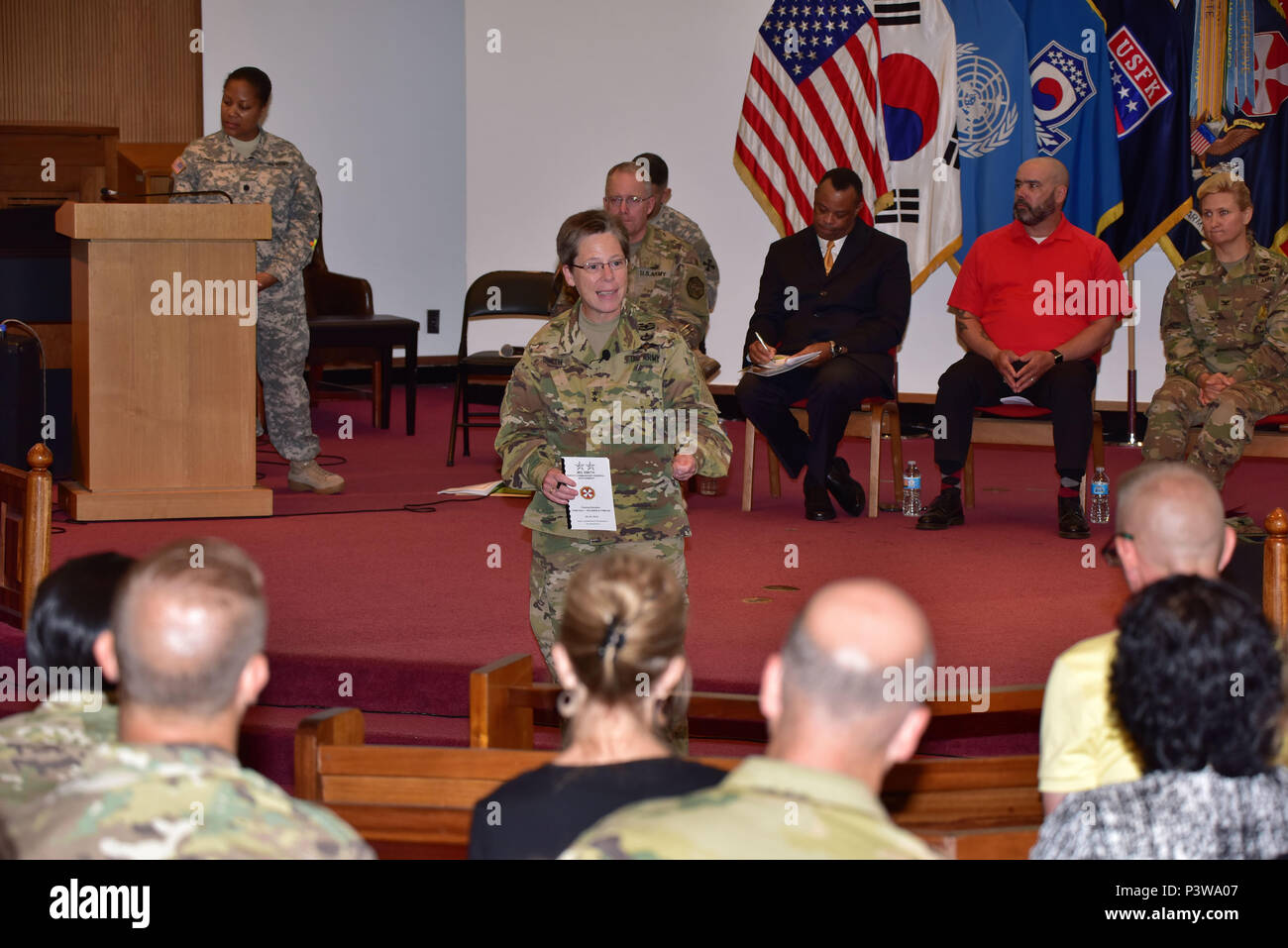 A spectator asks a question July 28 during the Transformation Town Hall ...