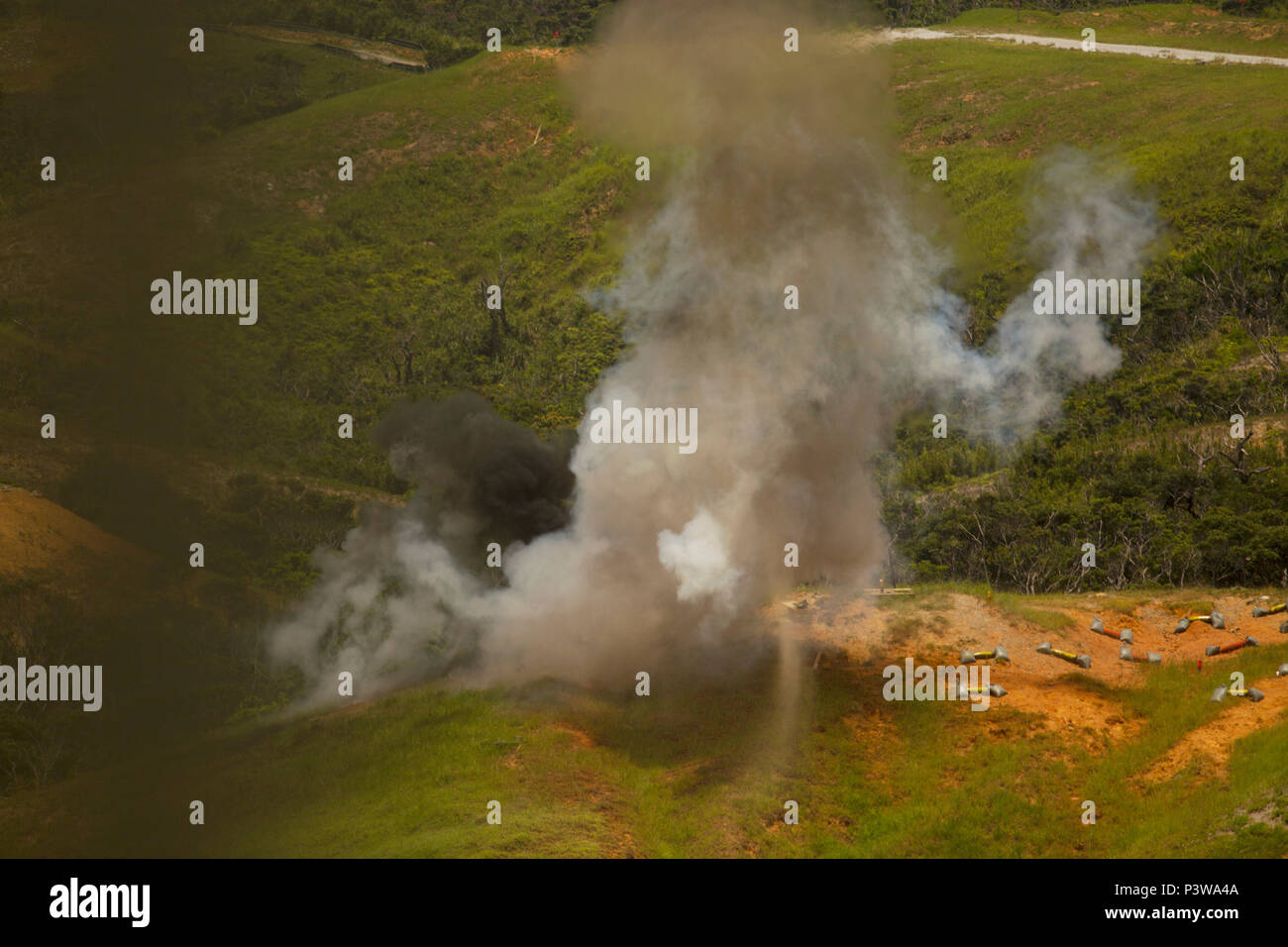 Smoke billows as a 50mm round impacts a 155mm artillery round July 28 ...