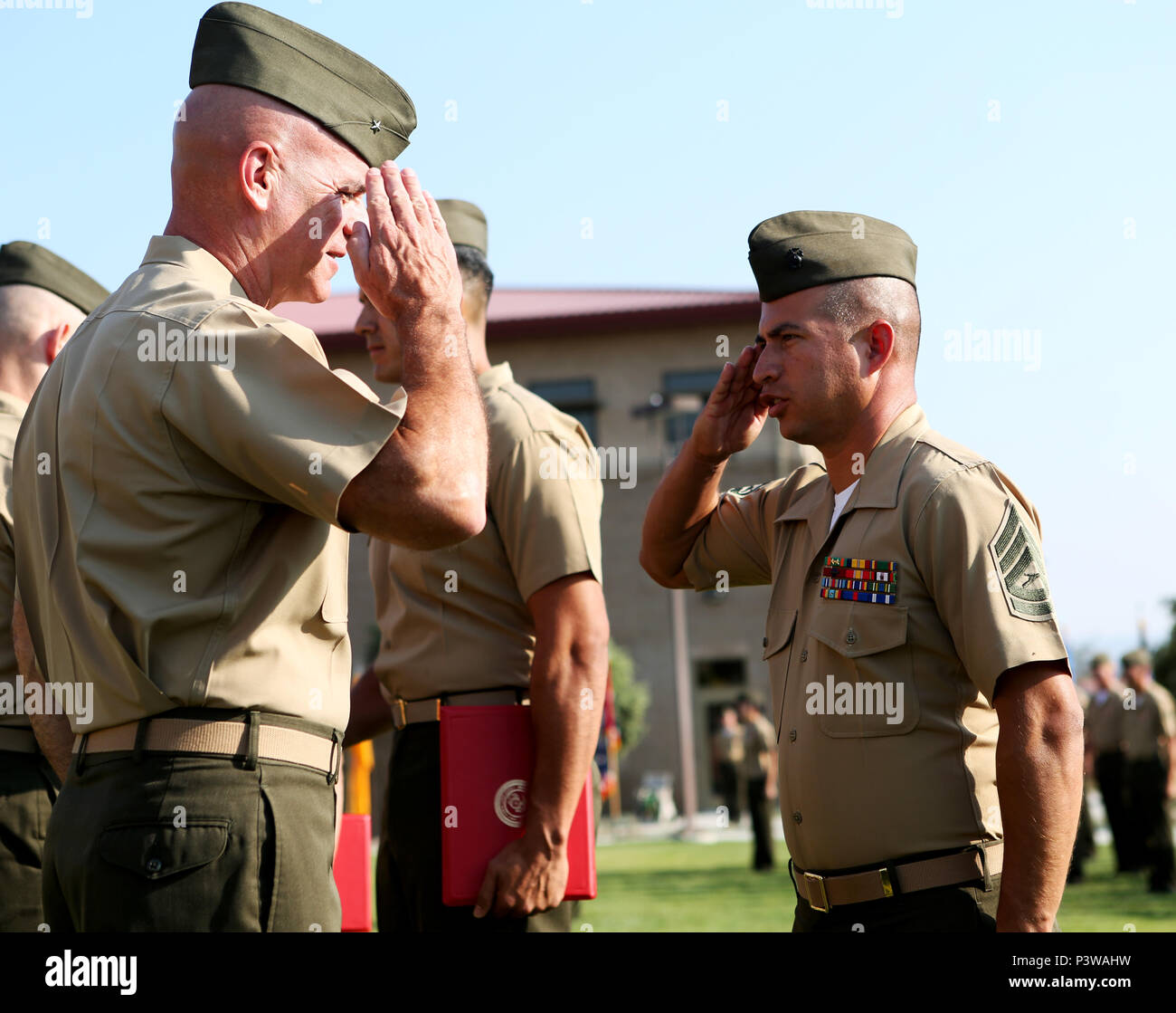 U.S. Marine Gunnery Sgt. Pablo Hernandez renders a salute to Brig. Gen ...