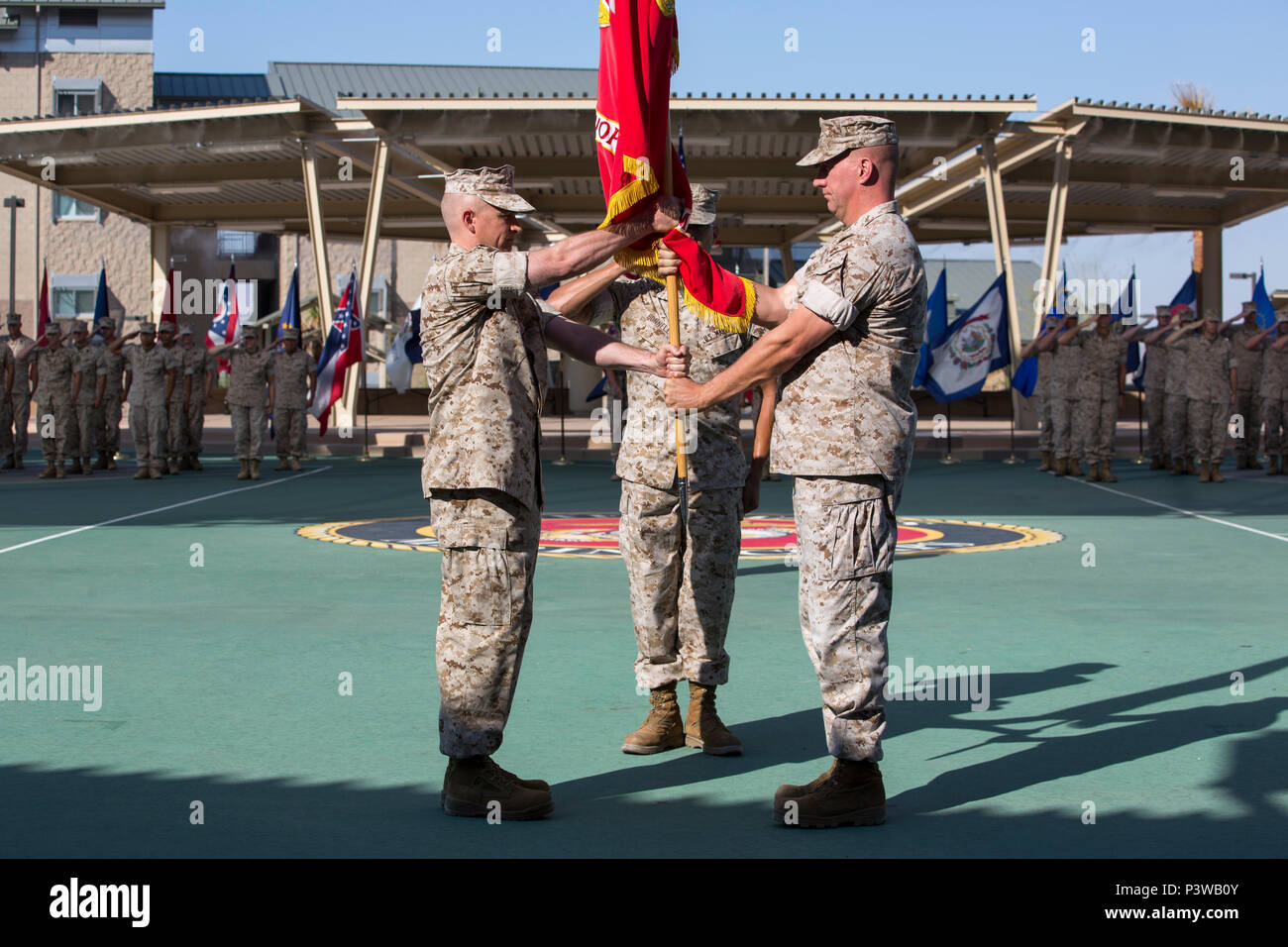 Col. Craig Wonson, outgoing commanding officer, passes the Marine Corps ...
