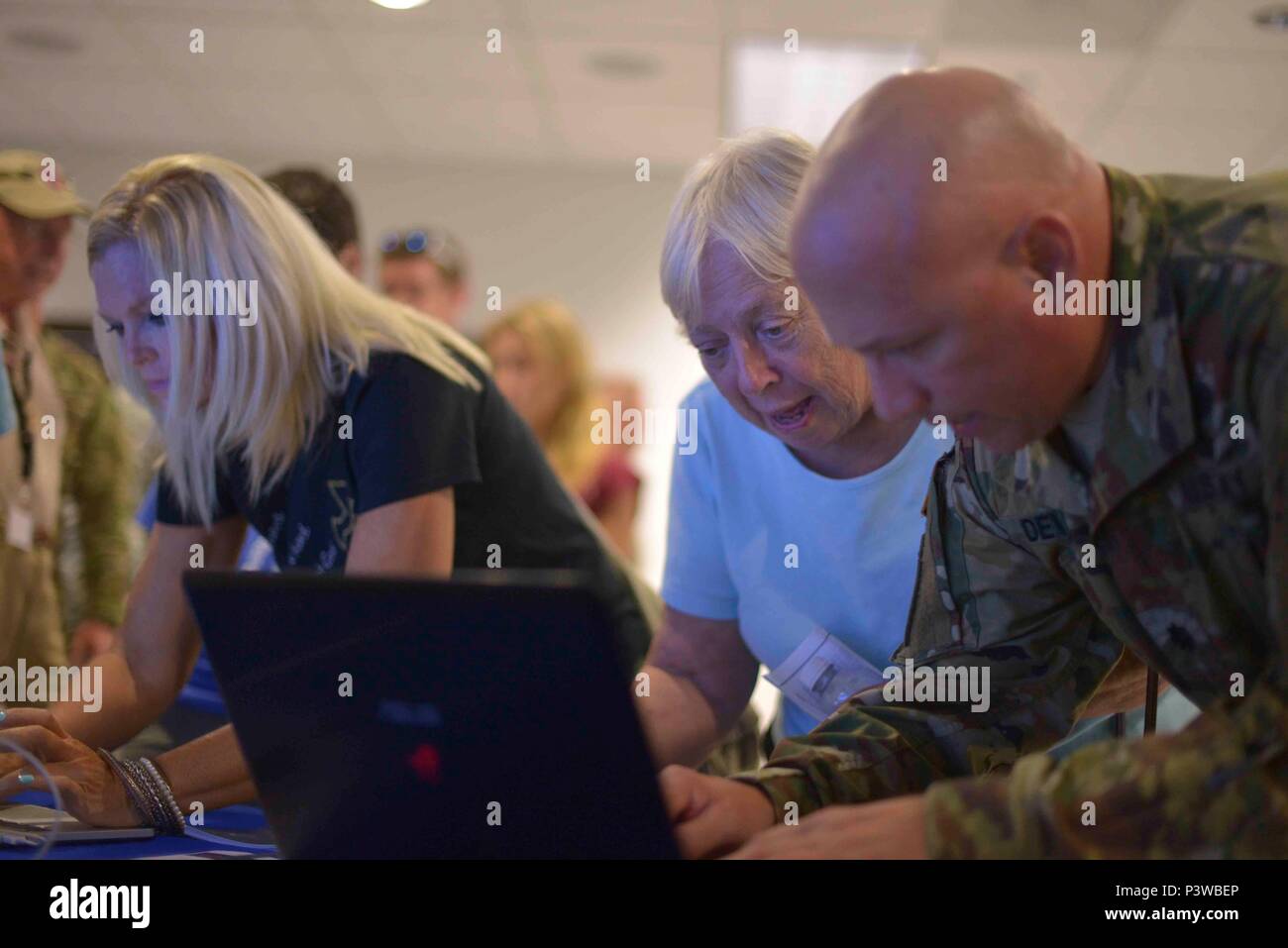 Raleigh, North Carolina – Lt. Col. Matt Devivo helps the family member ...