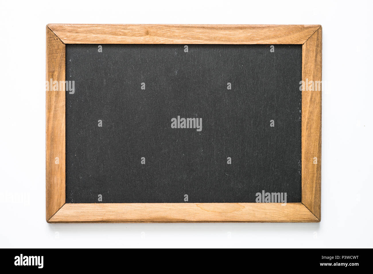 Vintage chalkboard in wooden frame on white background. Top view copy ...
