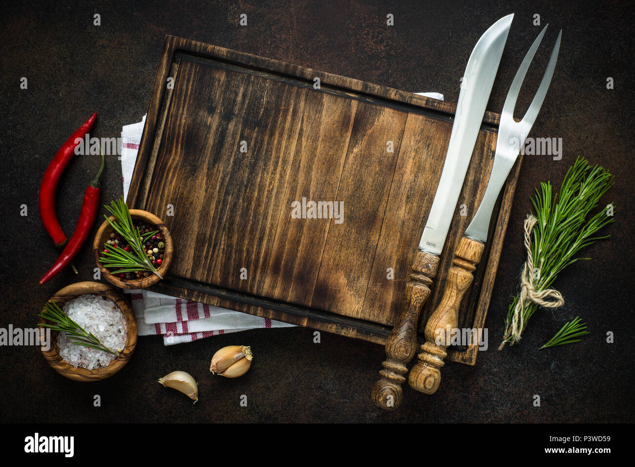 Food cooking background. Fork, knife, cutting board, spices and ...