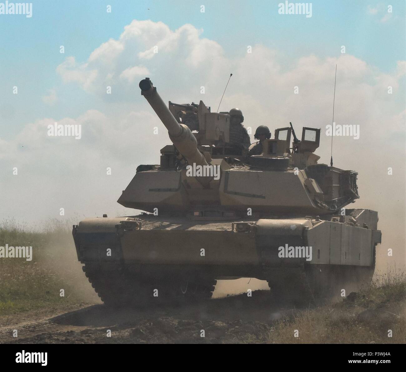 United States Army M1A1 Abrams Tanks maneuver across tank training ...