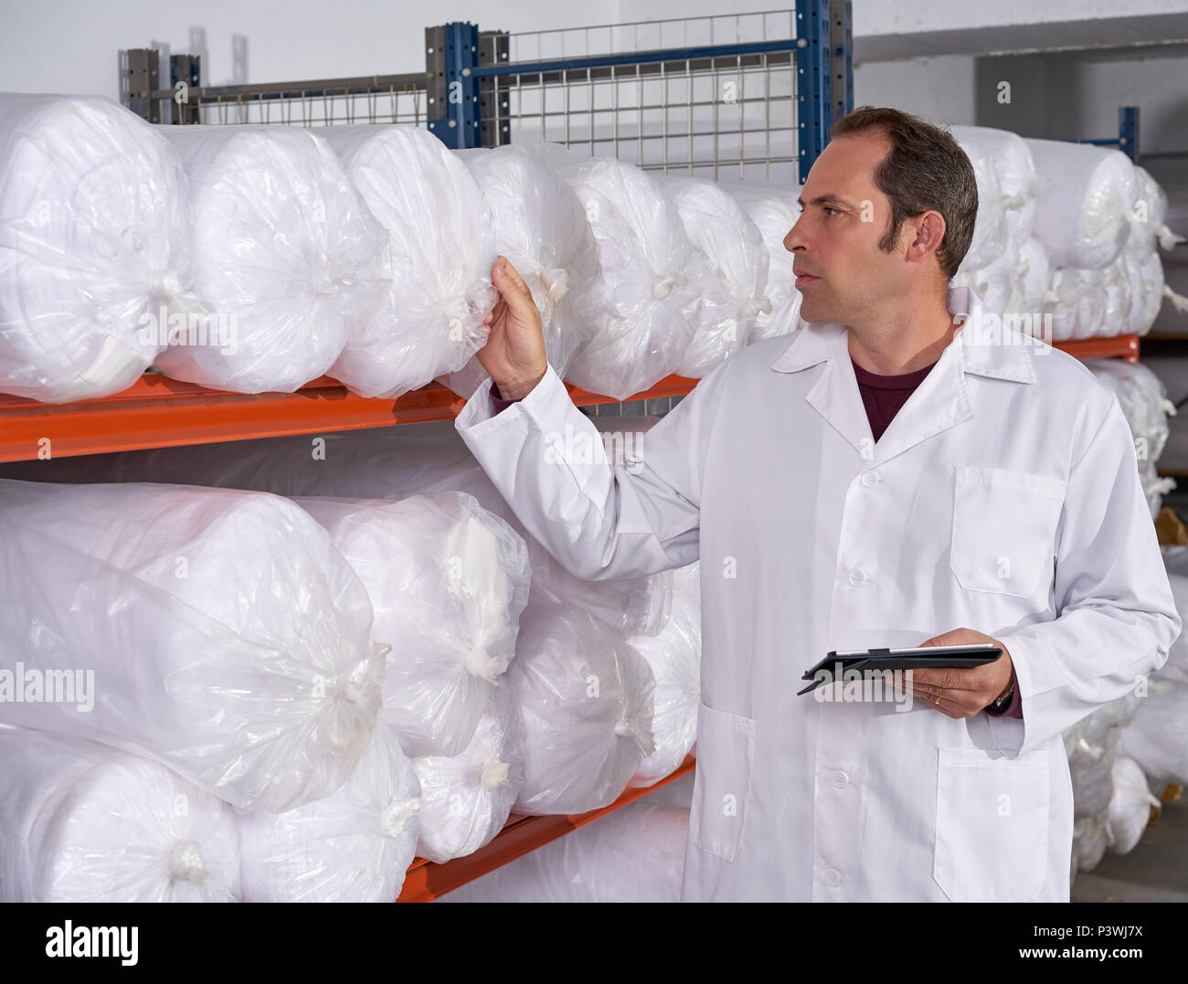 warehouse supervisor man manager in fashion textile factory Stock Photo ...