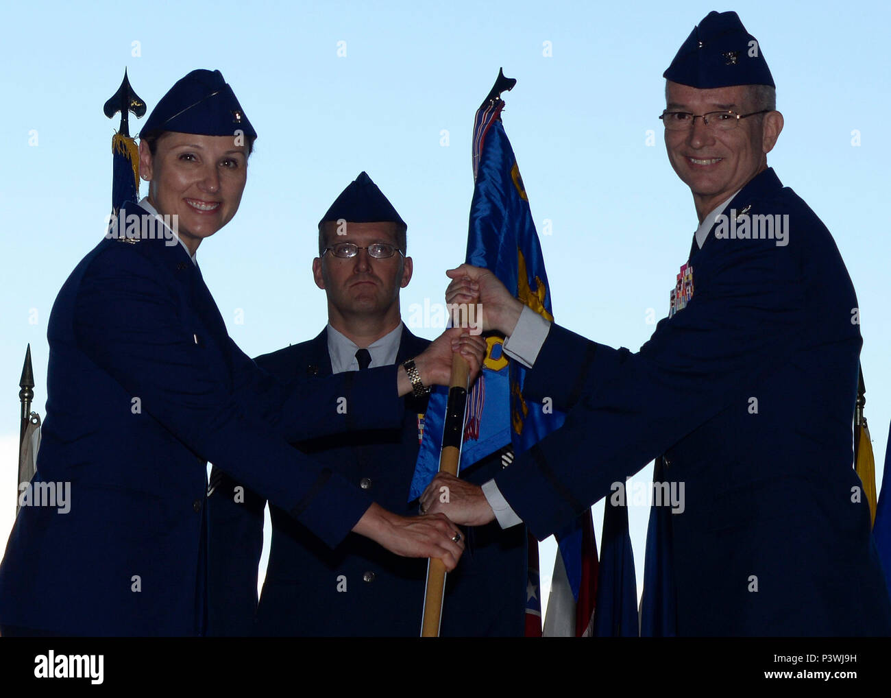 Col. April Vogel, commander of the 6th Air Mobility Wing, passes the ...