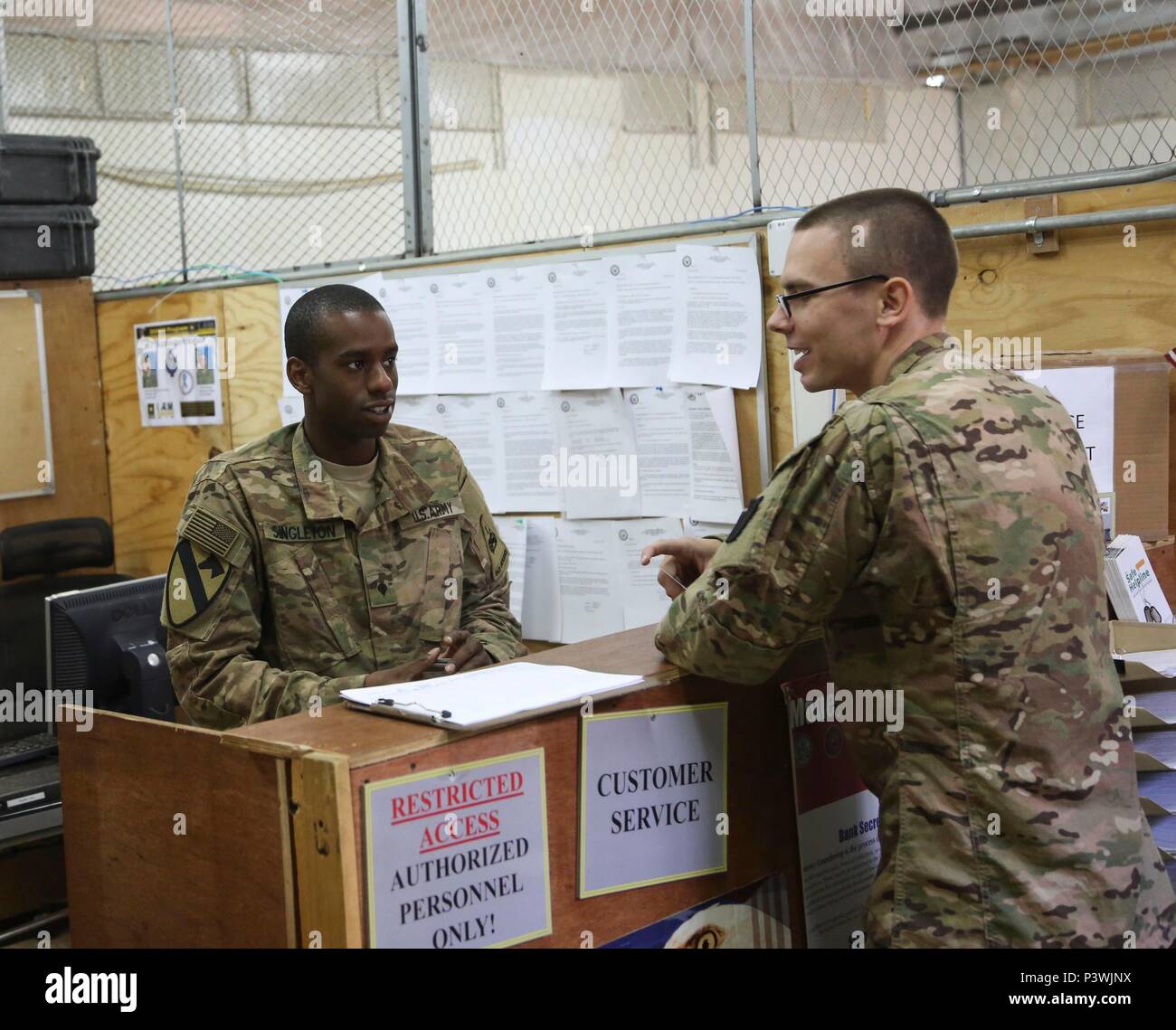 Spc. Dvante Singleton, left, a cashier, A Detachment, 4th Financial ...