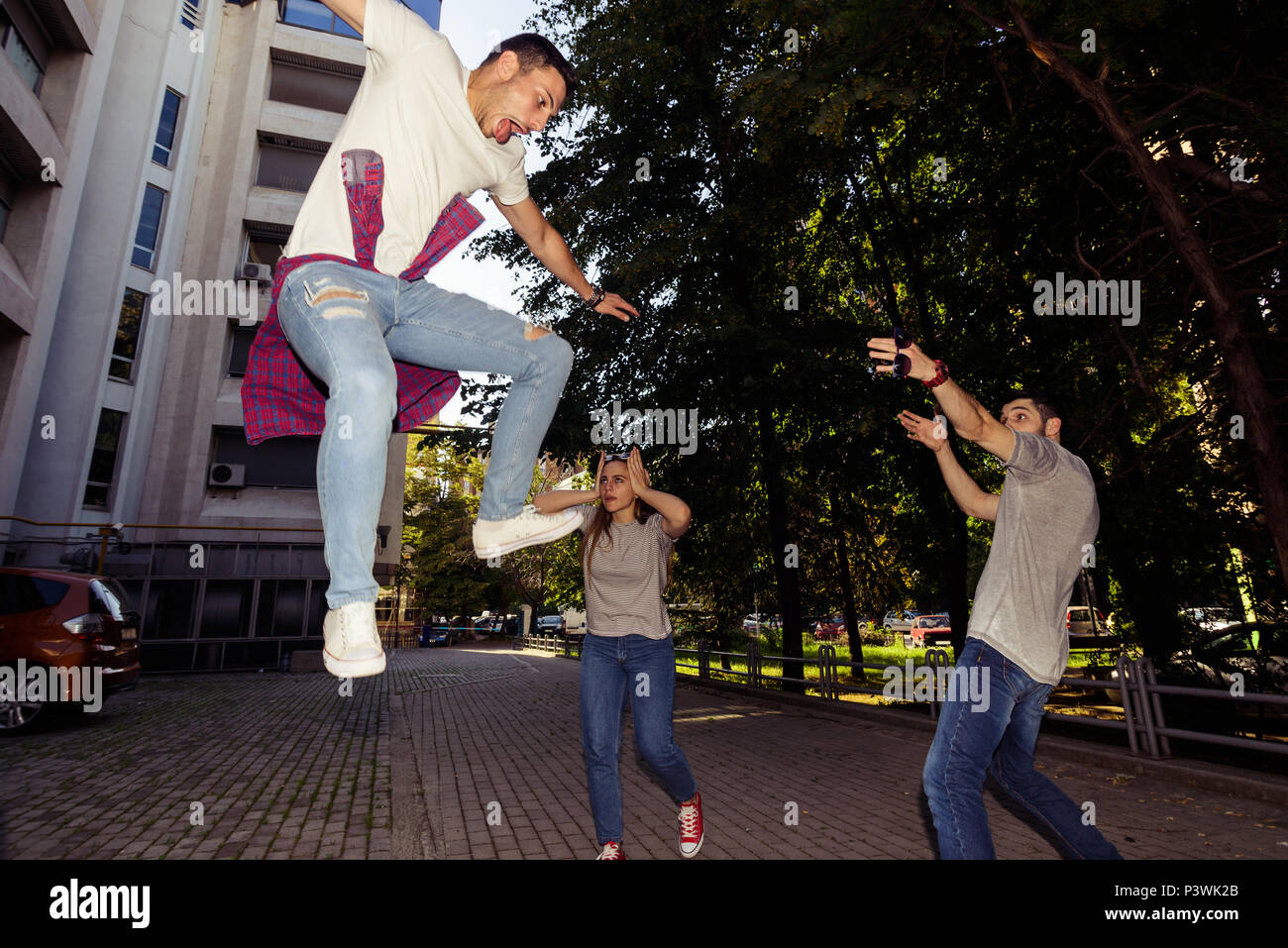 Group of friends having fun outdoors on summer time in downtown Stock ...