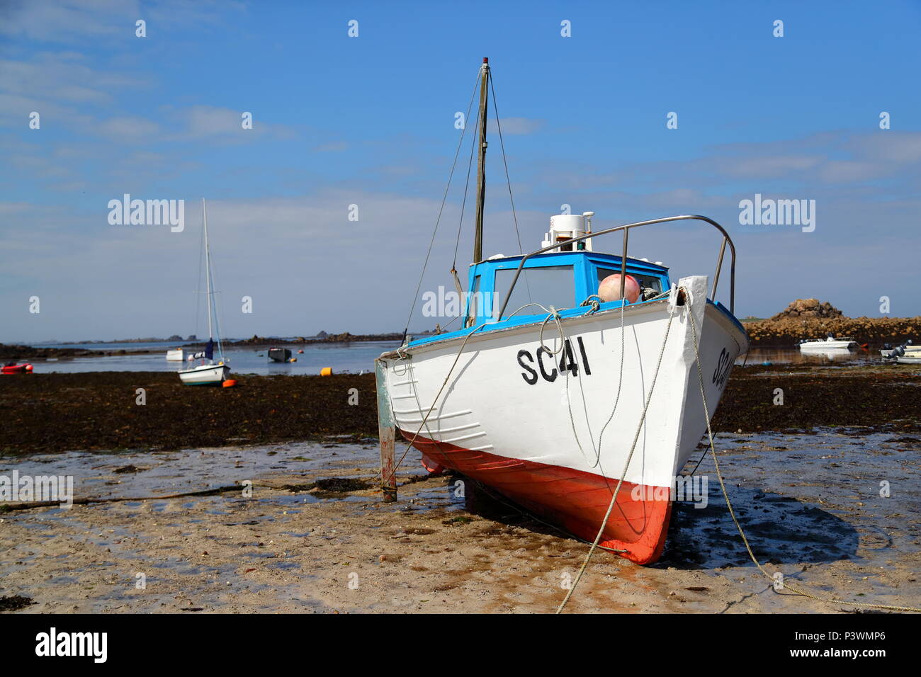 Fishing boat lying on the beach at St Agnes, Isles of Scilly, Cornwall ...
