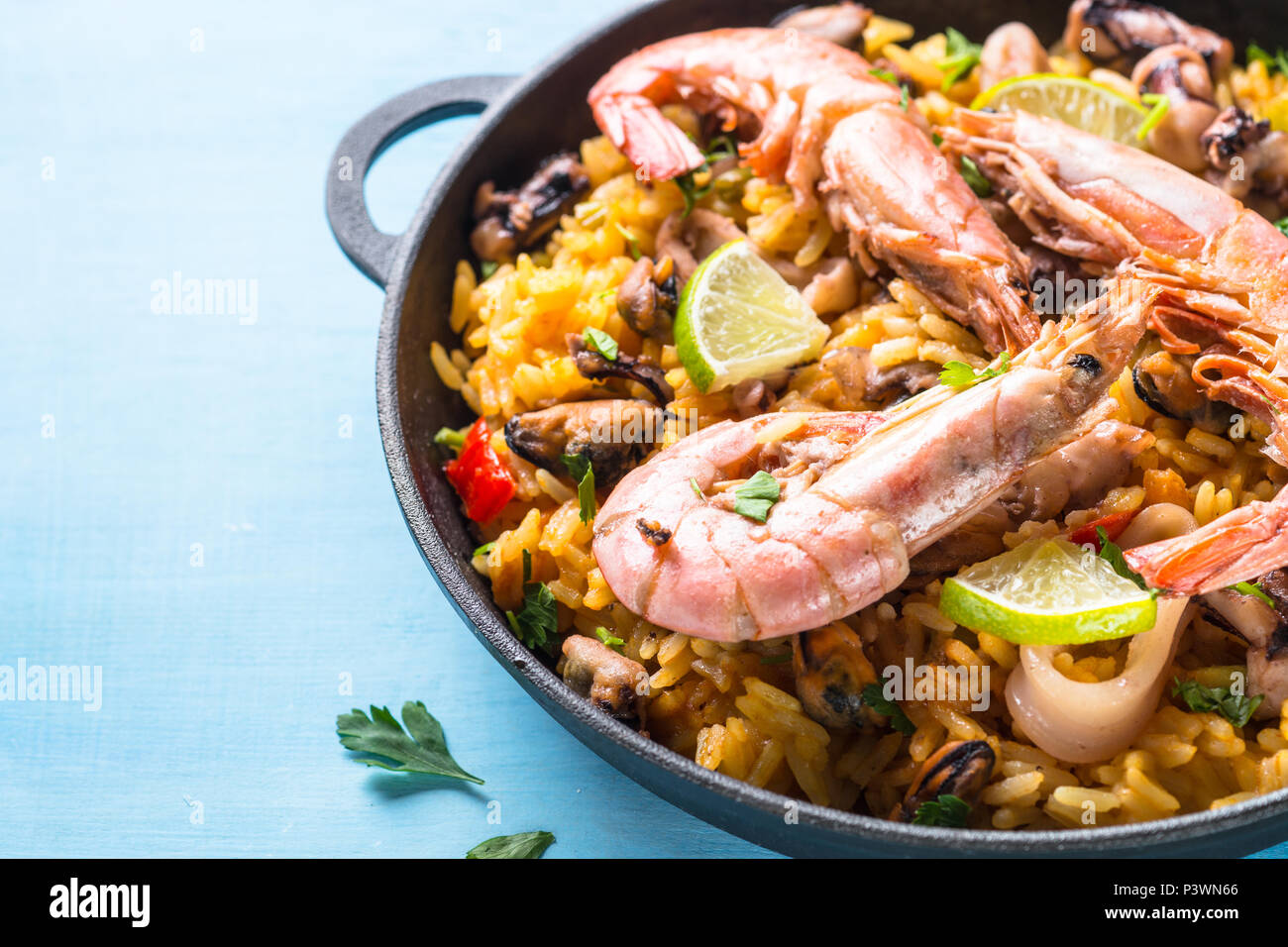 Seafood paella with shrimps, mussel and octopus. Traditional spanish ...