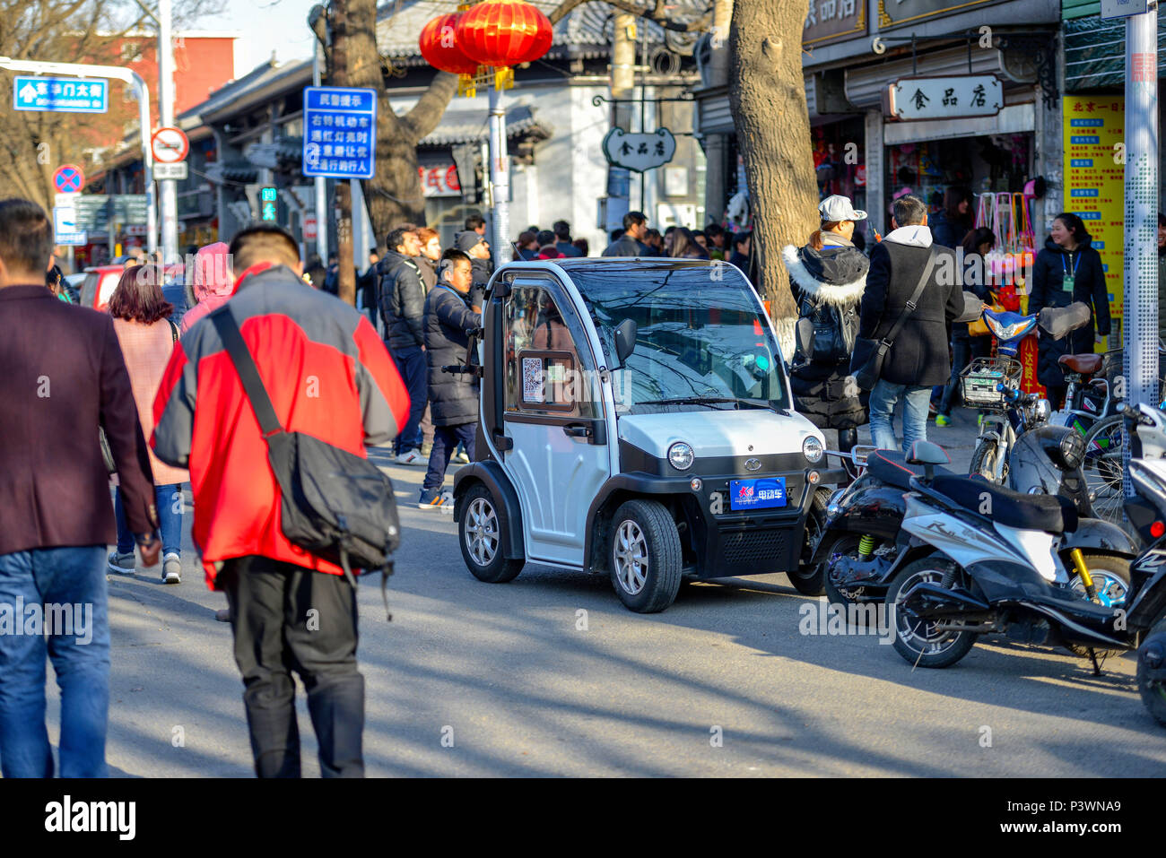 BEIJING, CHINA - MARCH 11, 2016: People are driving through the streets ...