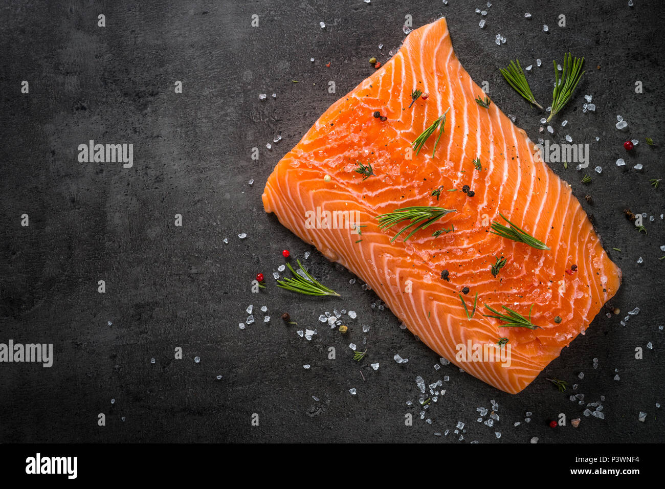 Fresh fish. Salmon uncooked fillet on black slate table. Top view Stock ...