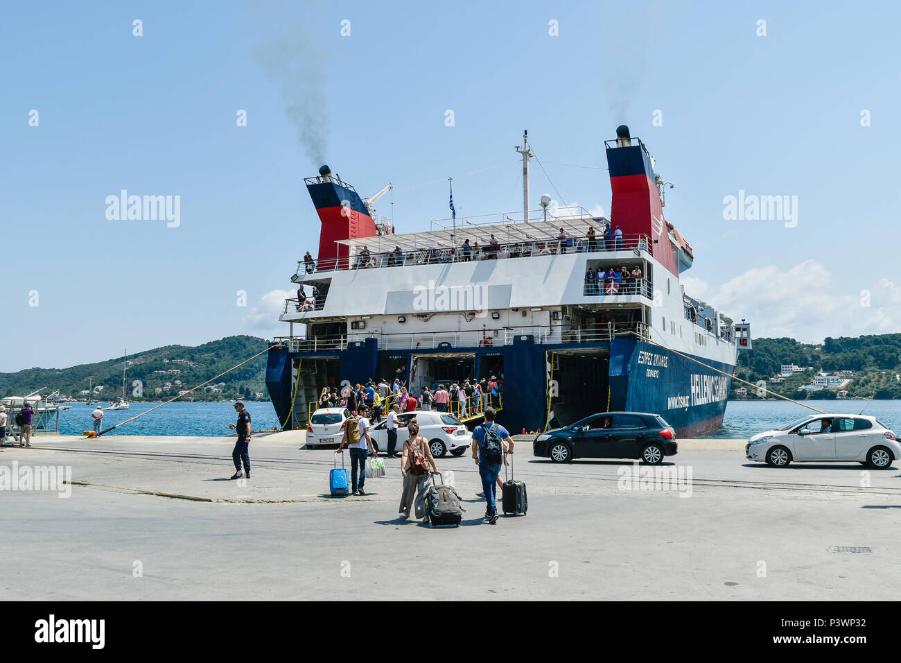 Boarding a ferry on Skiathos island Greece Stock Photo - Alamy