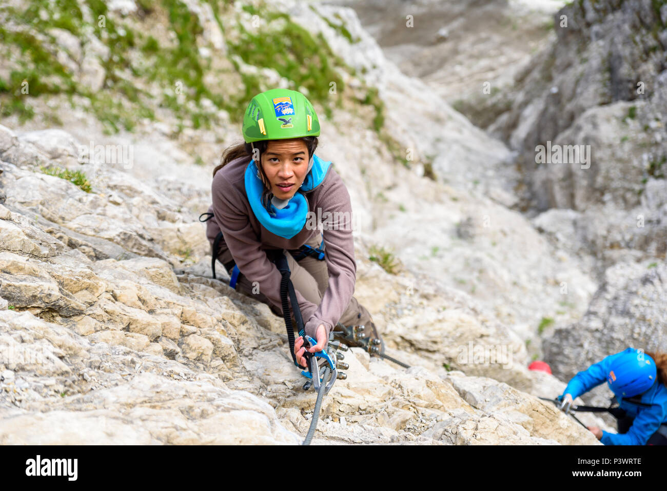 Hiker climbing in the mountain of Alps, Europe Stock Photo - Alamy