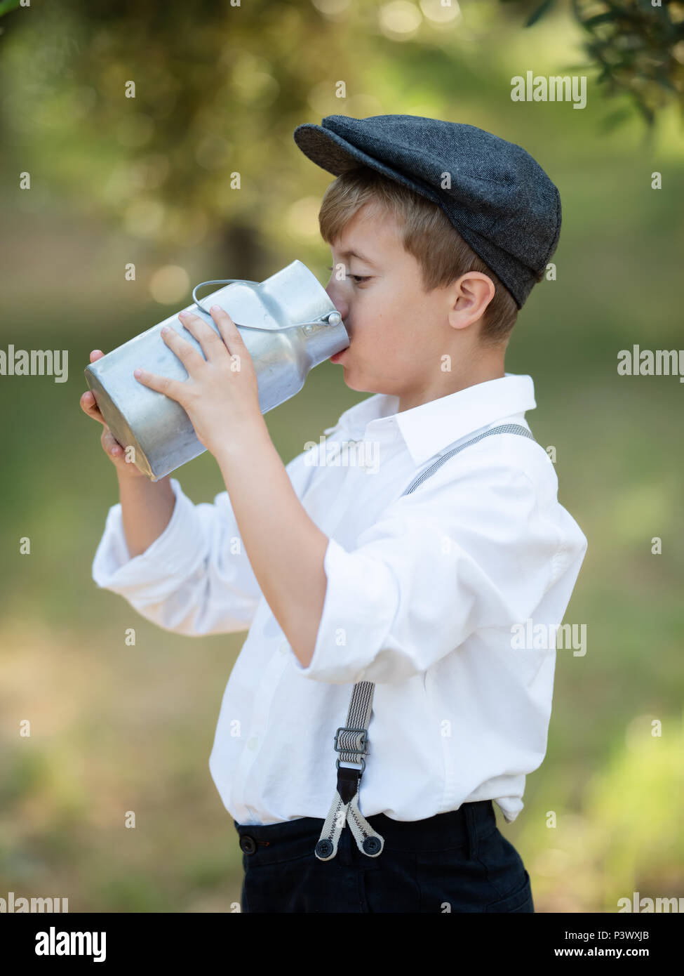 boy drinks milk from an aluminum can Stock Photo - Alamy
