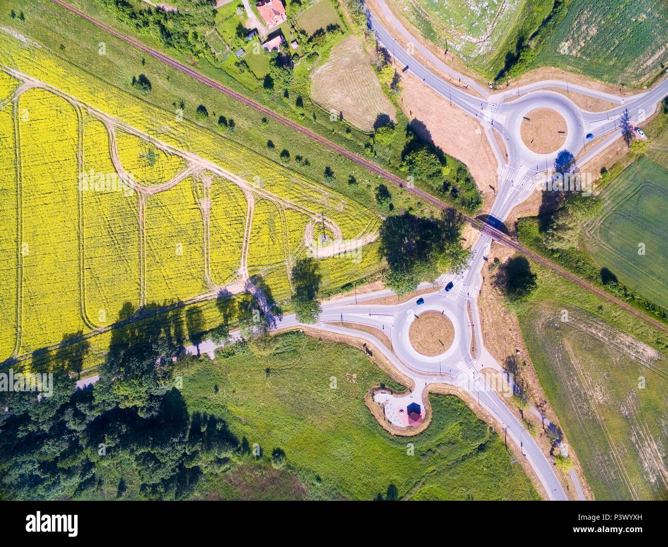 Aerial view of roundabout circles, railroad line and bike lanes near ...