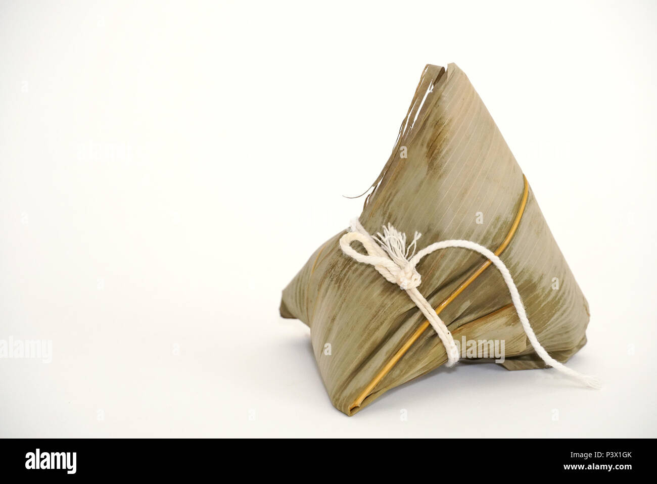 Sticky rice dumpling on white background Stock Photo - Alamy