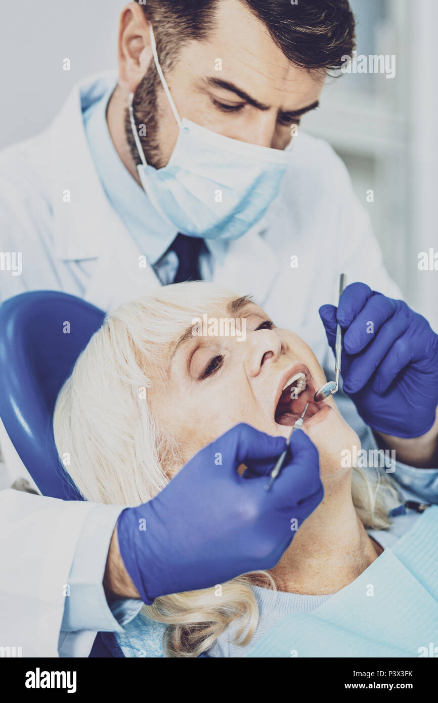 Professional practitioner supporting his patient Stock Photo - Alamy