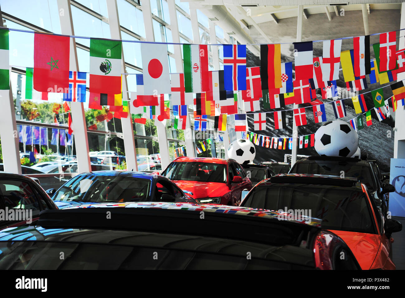 Car showroom showing Flags of different countries playing in 2018 World ...