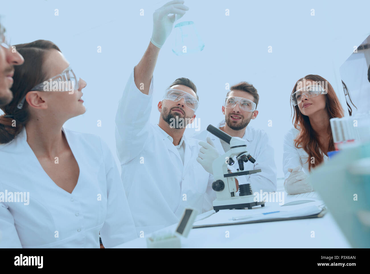 group of young workers are working in biochemistry lab Stock Photo - Alamy