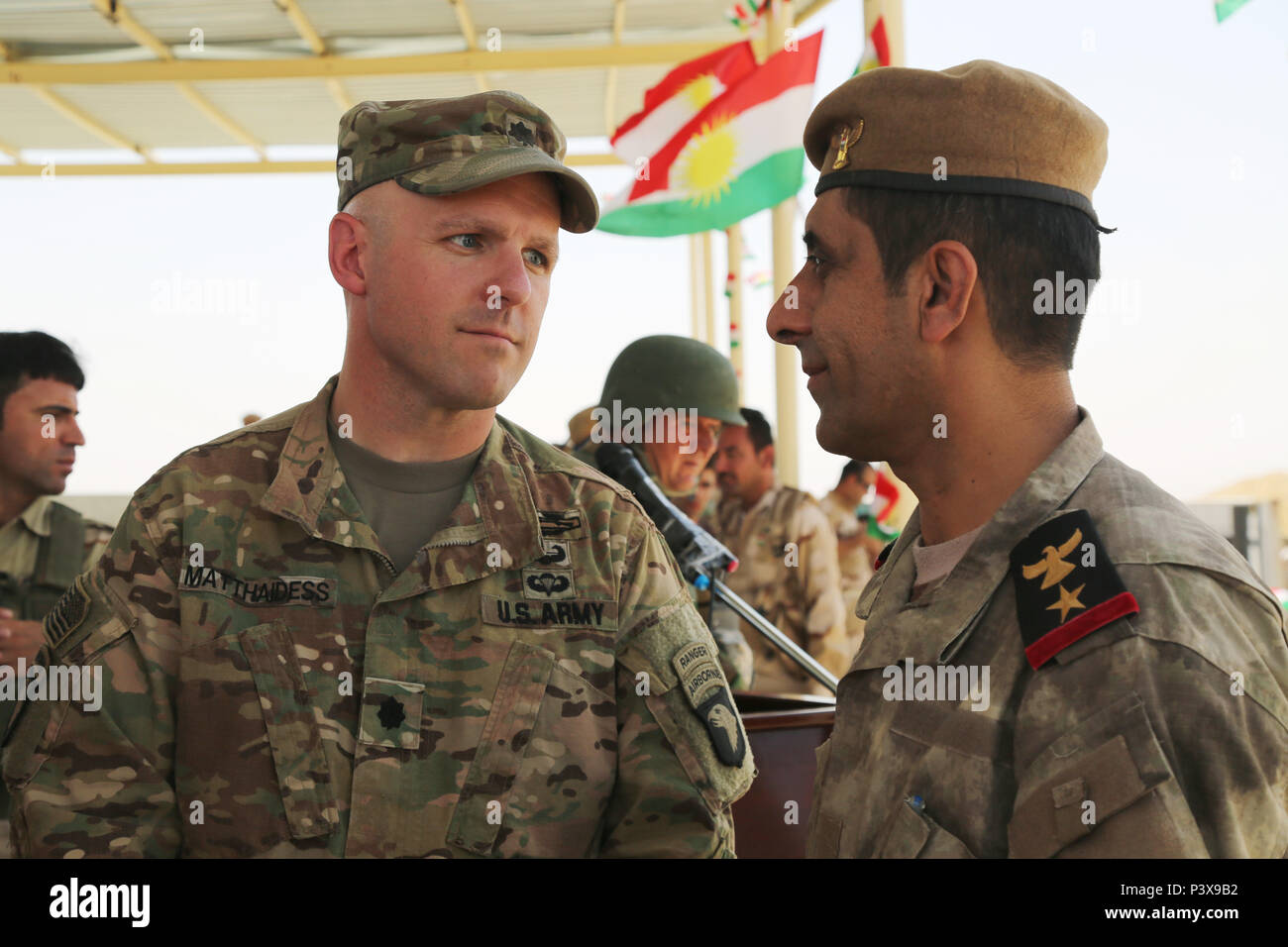 U.S. Army Lt. Col. Edwin Matthaidess, commander Task Force Falcon, talks with Staff Lt. Col ...