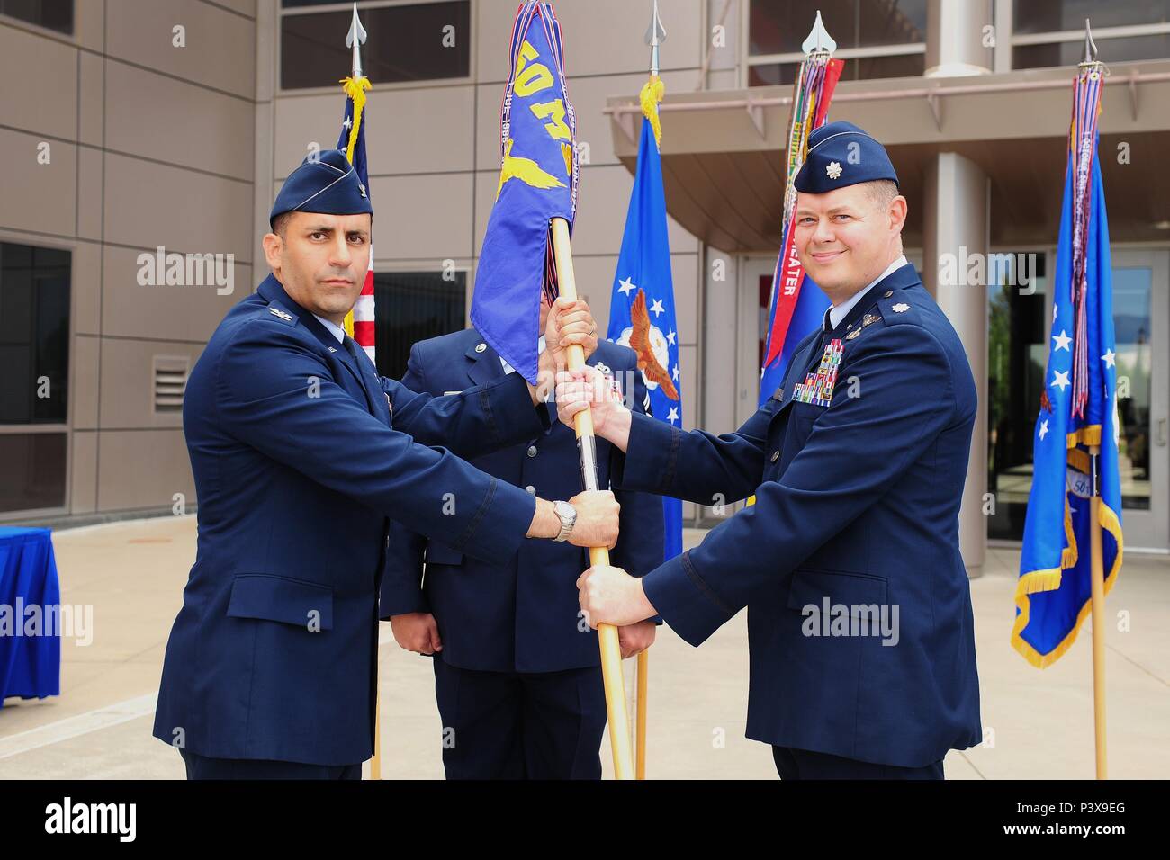 Col. Jason Janaros, 50th Mission Support Group commander, presents the ...