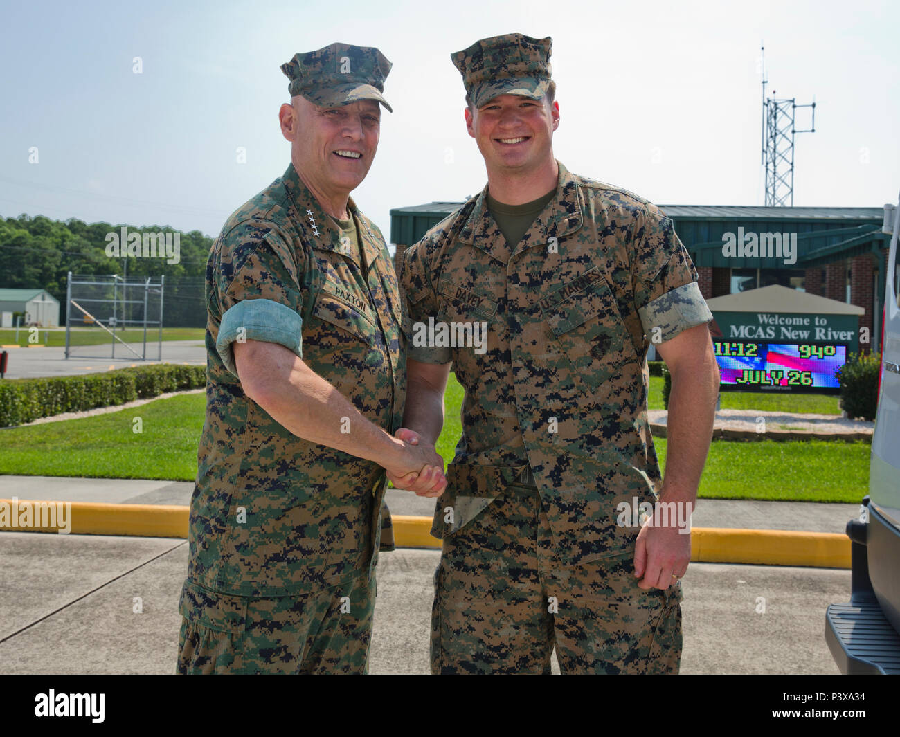 U.S. Marine Corps Gen. John M. Paxton Jr., left, 33rd assistant ...