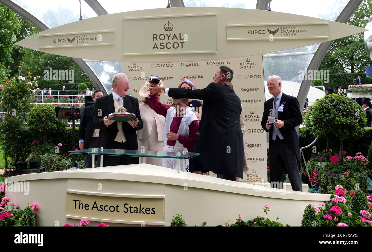 Jockey Andrea Atzeni and trainer Willie Mullins are presented with the ...