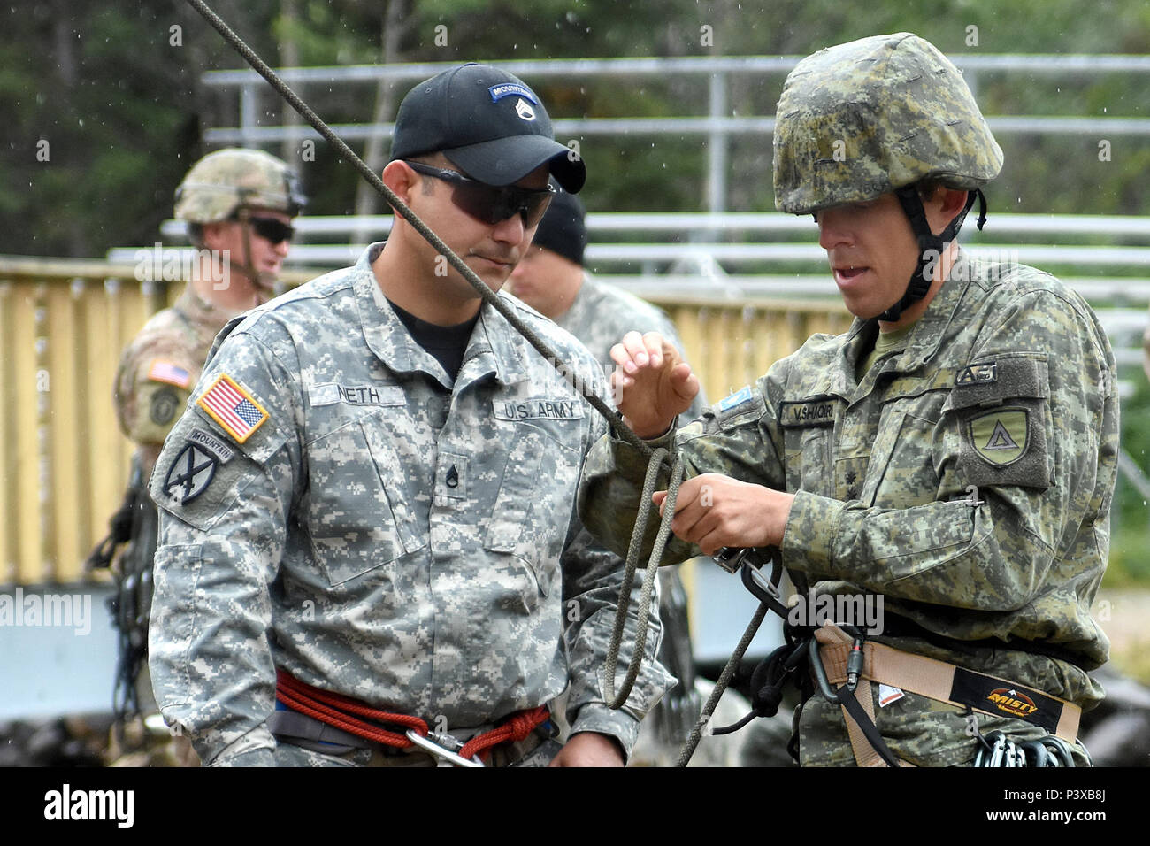 A Northern Warfare Training Center instructor observes as a First ...