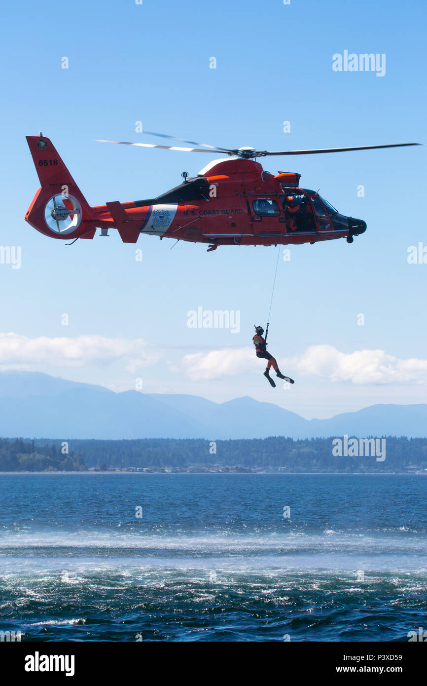 An MH-65 dolphin helicopter from Coast Guard Air Station Port Angeles ...
