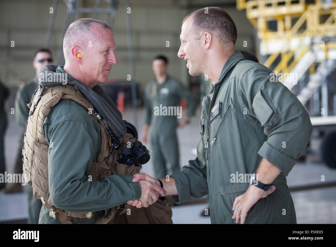 Col. Chad Blair, left, greets Maj. Christopher Sherwood, an MV-22B ...