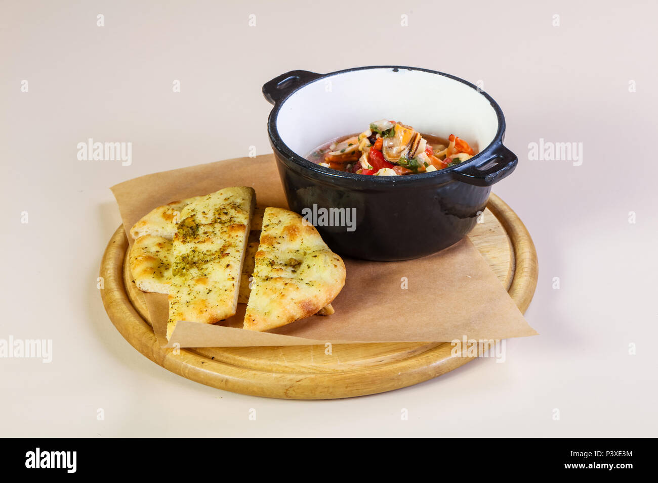 Seafood suop with bread and spices Stock Photo - Alamy