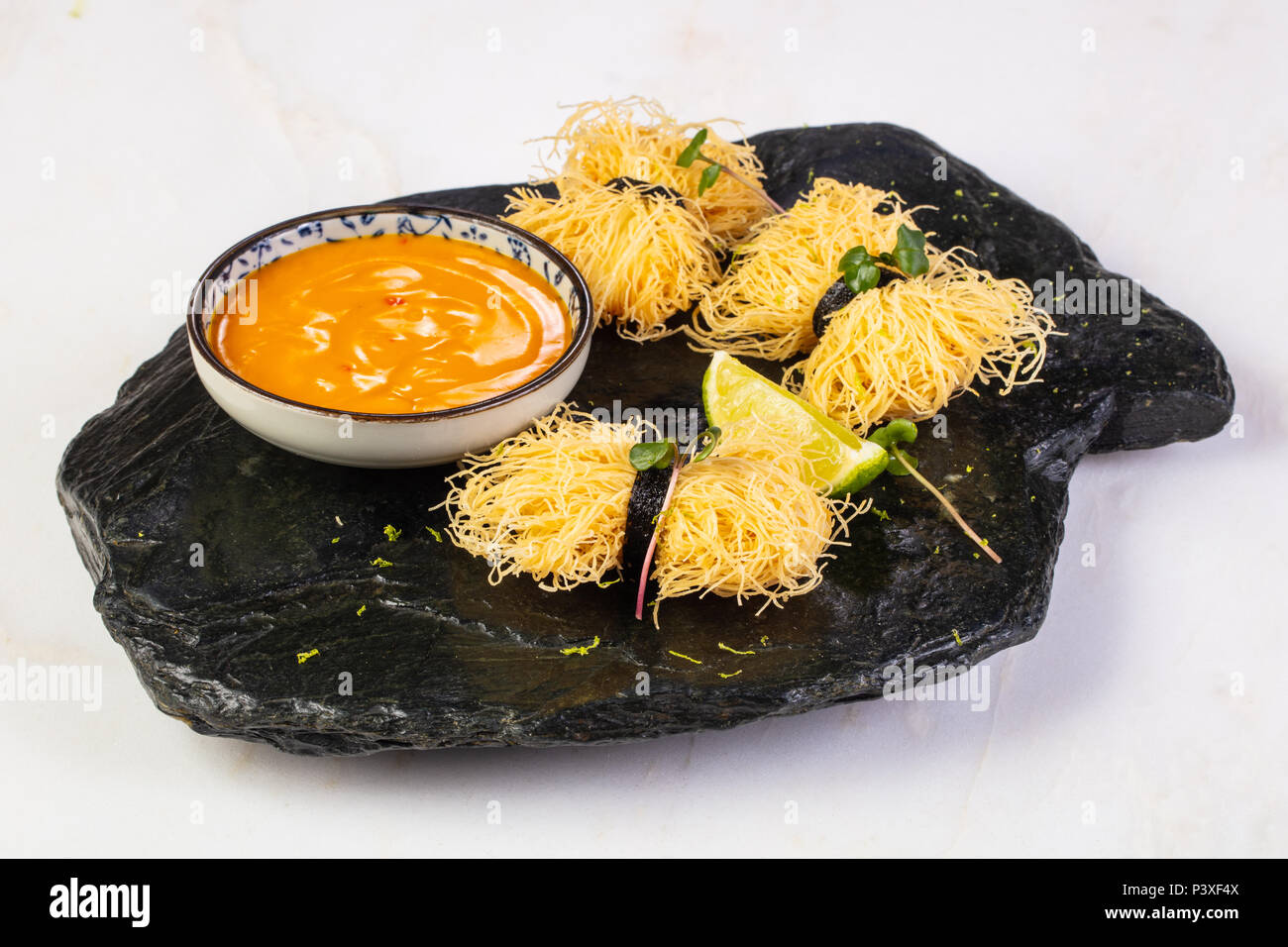 Shrimp in kataifi with mango sauce Stock Photo - Alamy