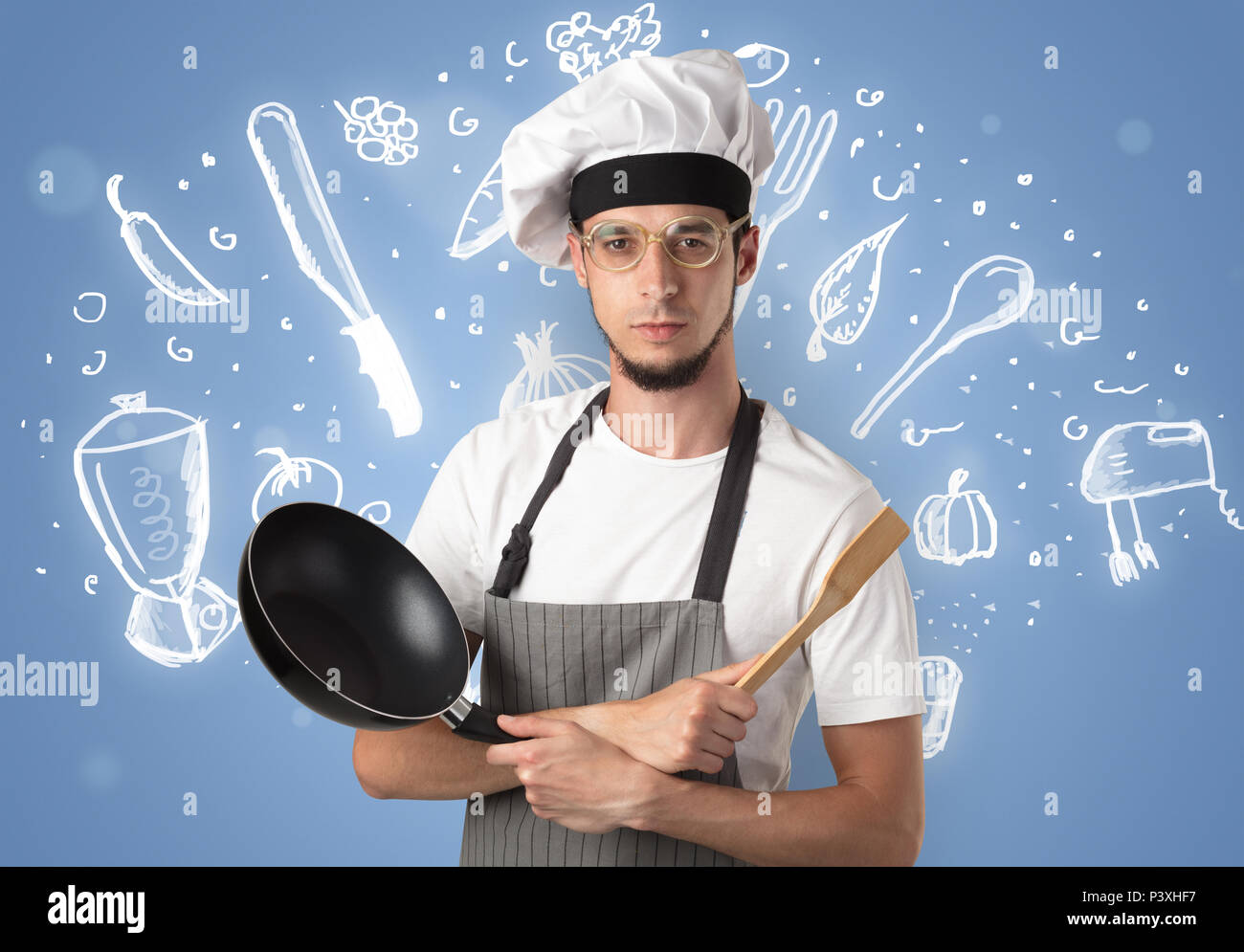 Young cook with kitchen instruments and drawn recipe concept on ...