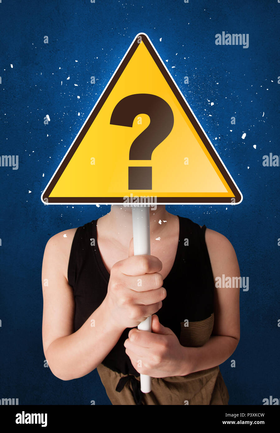 Casual young woman holding yellow sign with question mark Stock Photo ...