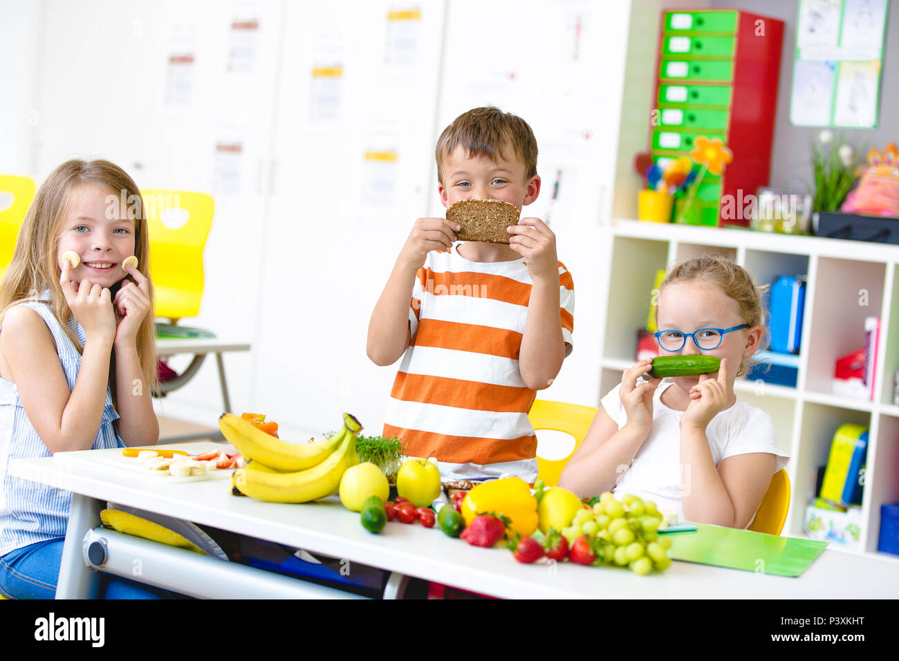 At school - Students prepare their healthy snack themselves Stock Photo ...