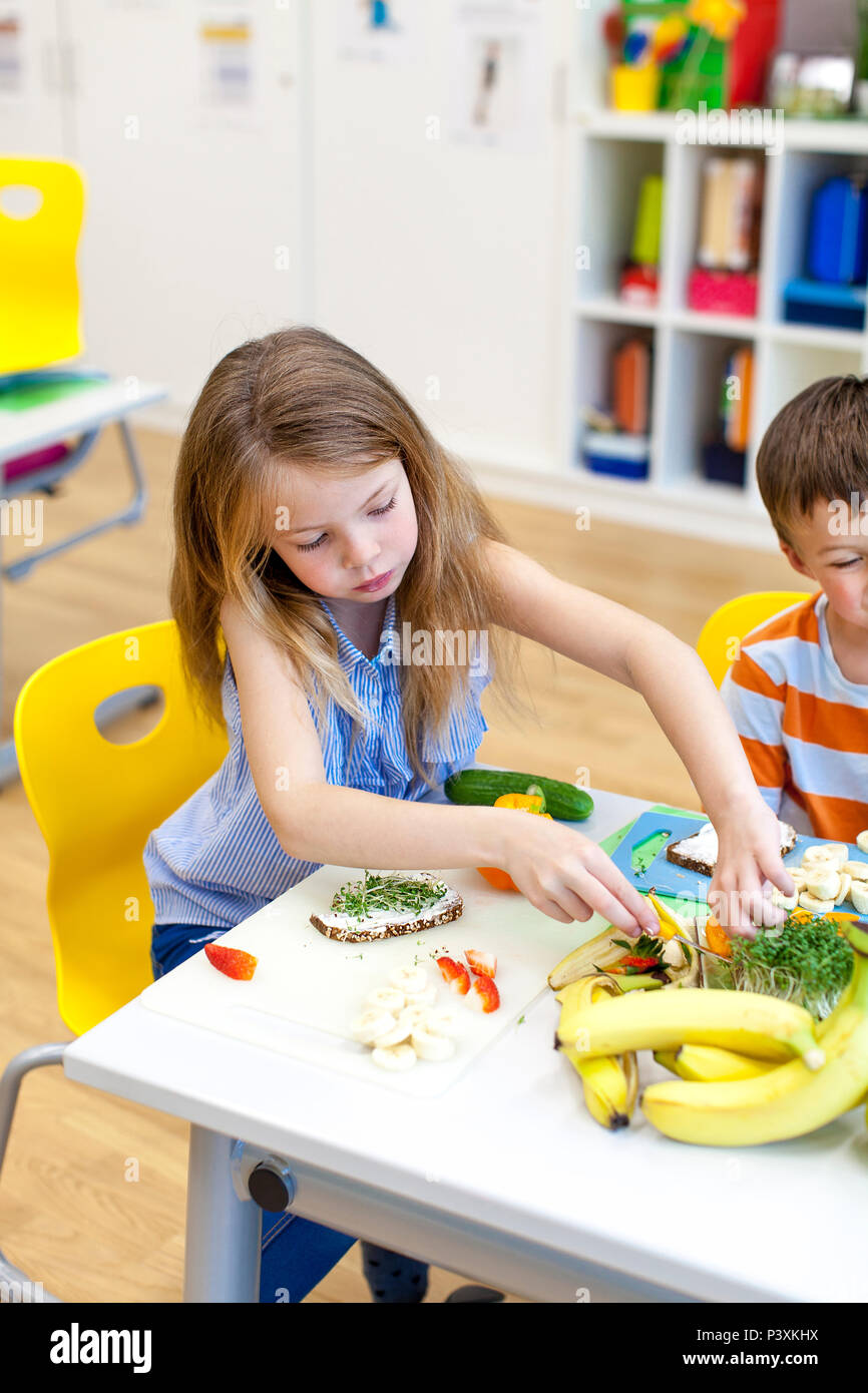 At school - Students prepare their healthy snack themselves Stock Photo ...