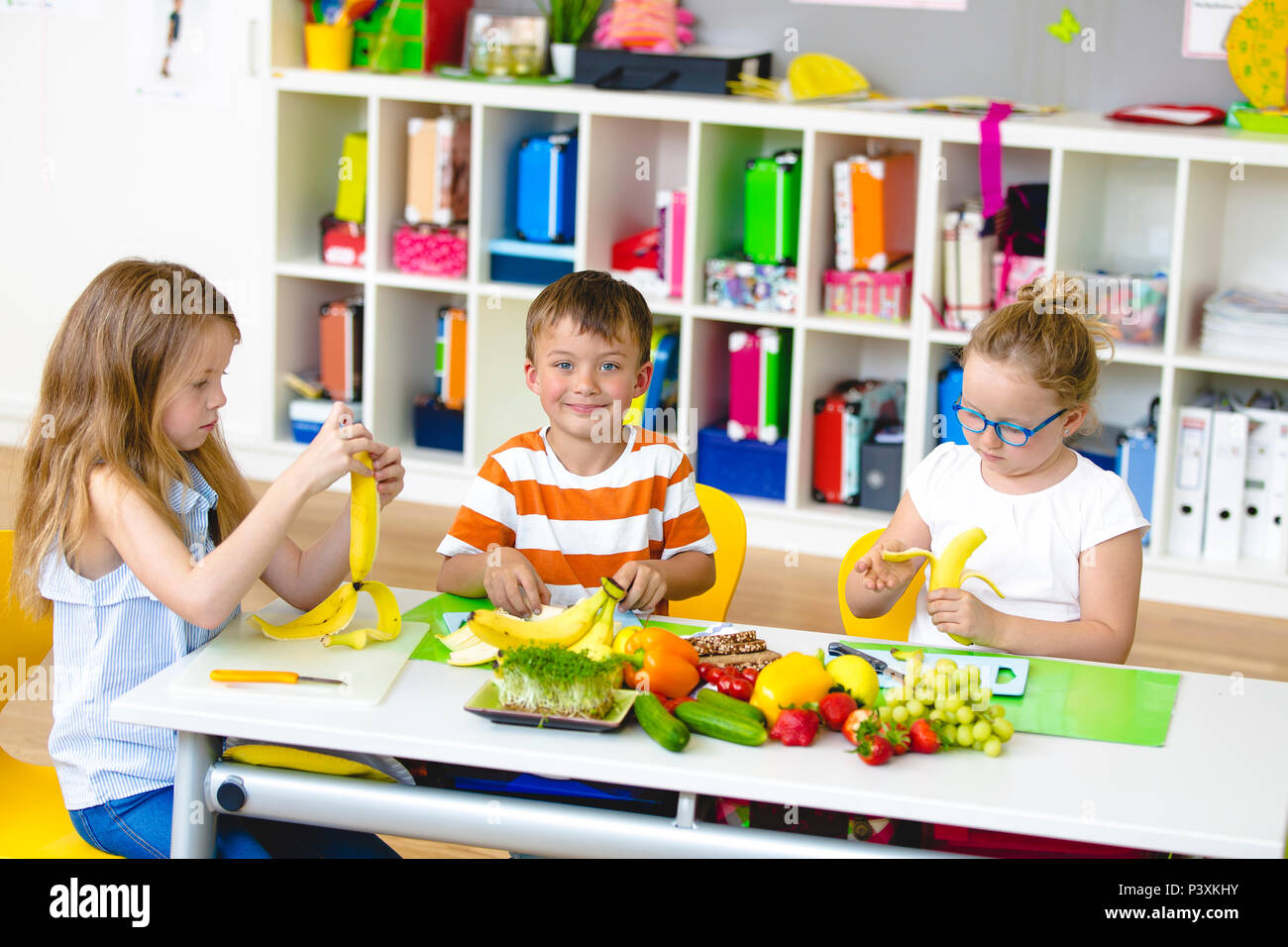 At school - Students prepare their healthy snack themselves Stock Photo ...