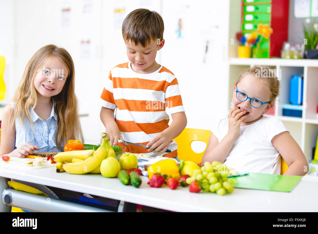 At school - Students prepare their healthy snack themselves Stock Photo ...